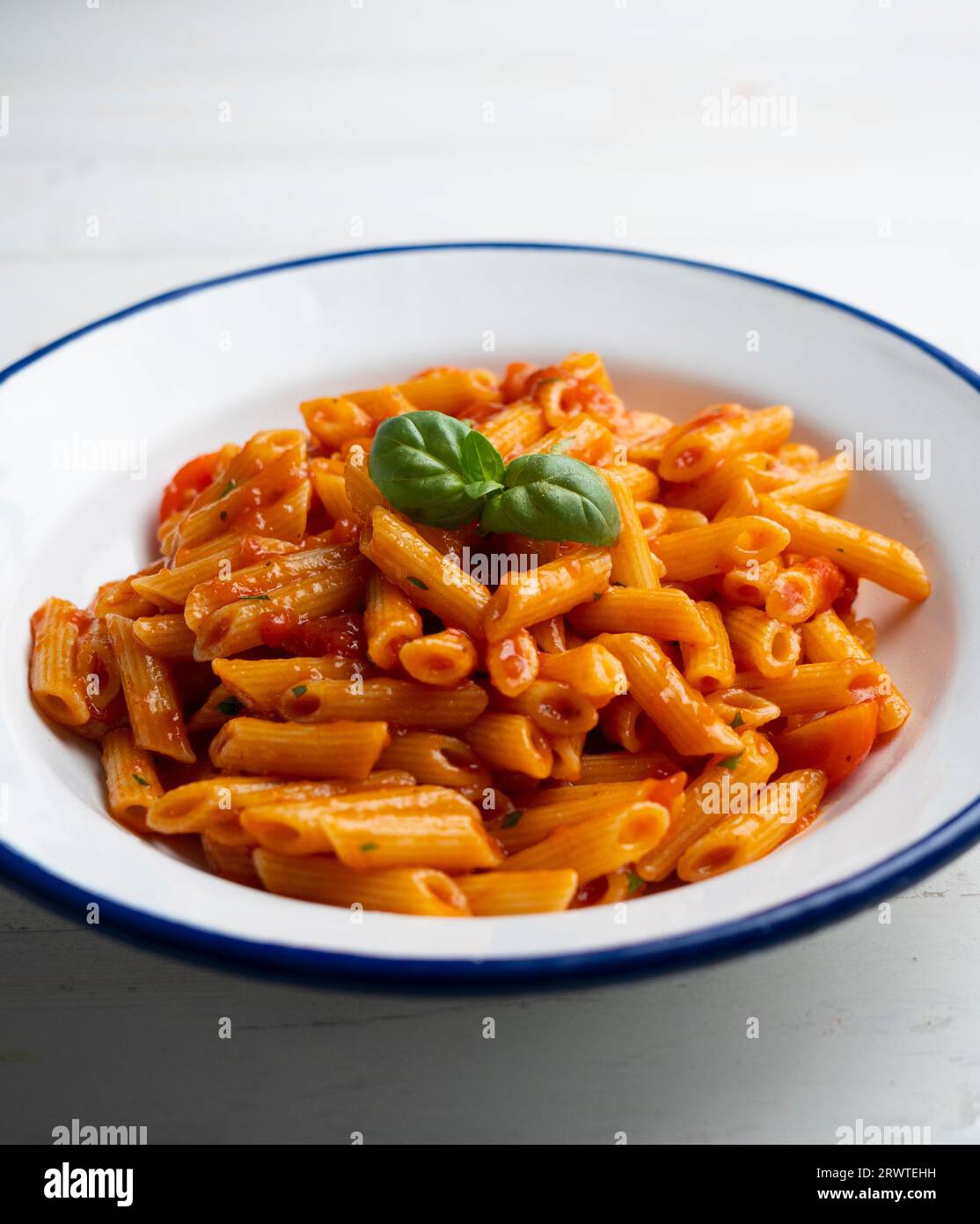 Italian macaroni with tomato and basil sauce Stock Photo - Alamy