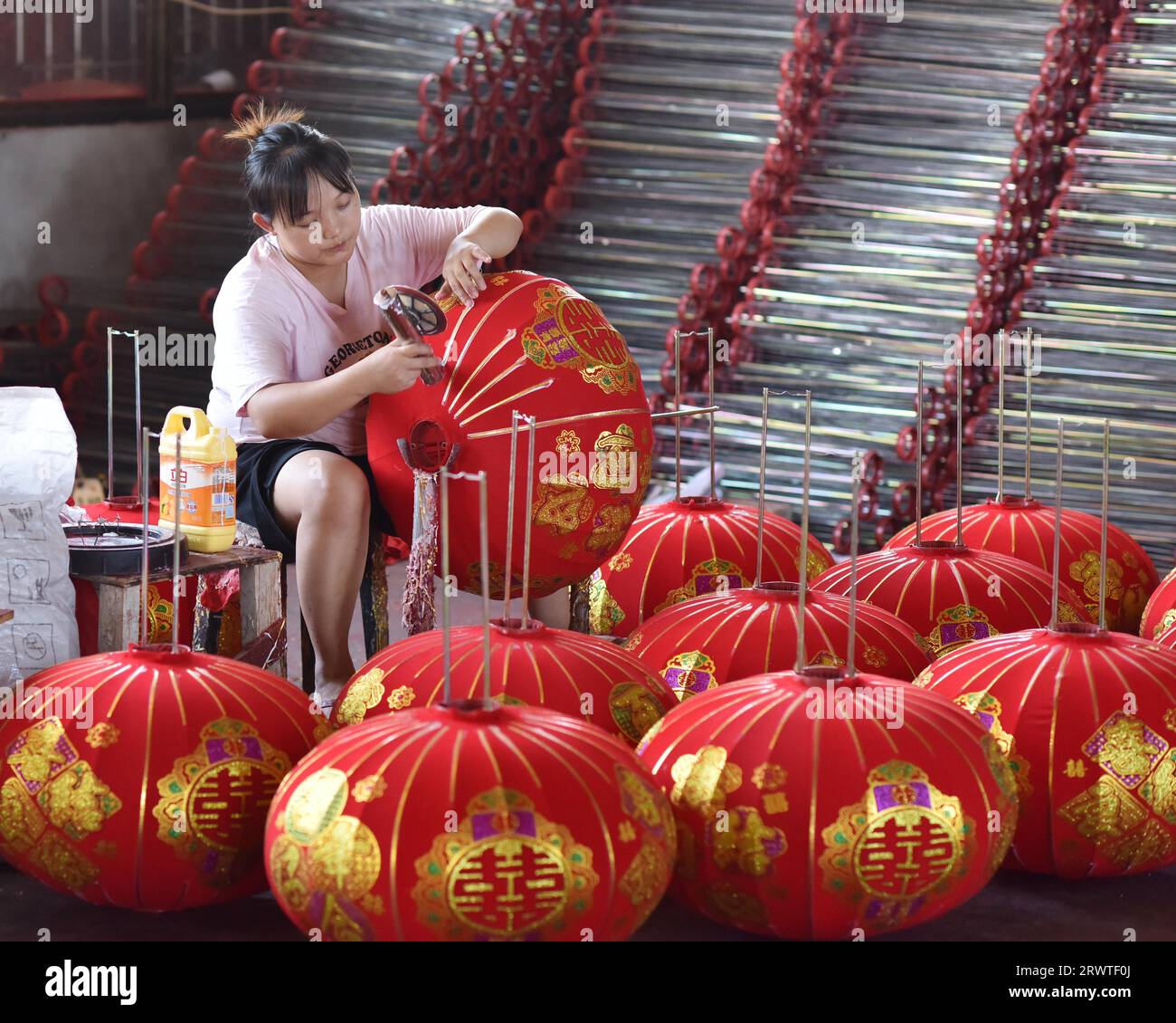 Workers make red lanterns for the upcoming Mid-Autumn Festival and ...