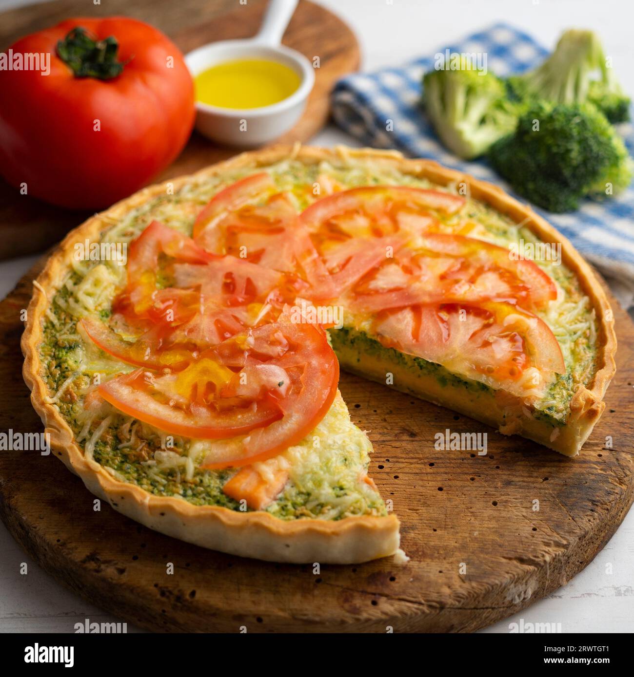 French style quiche with broccoli, salmon, and slices tomato Stock ...