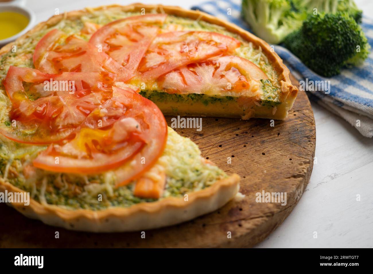 French style quiche with broccoli, salmon, and slices tomato Stock ...