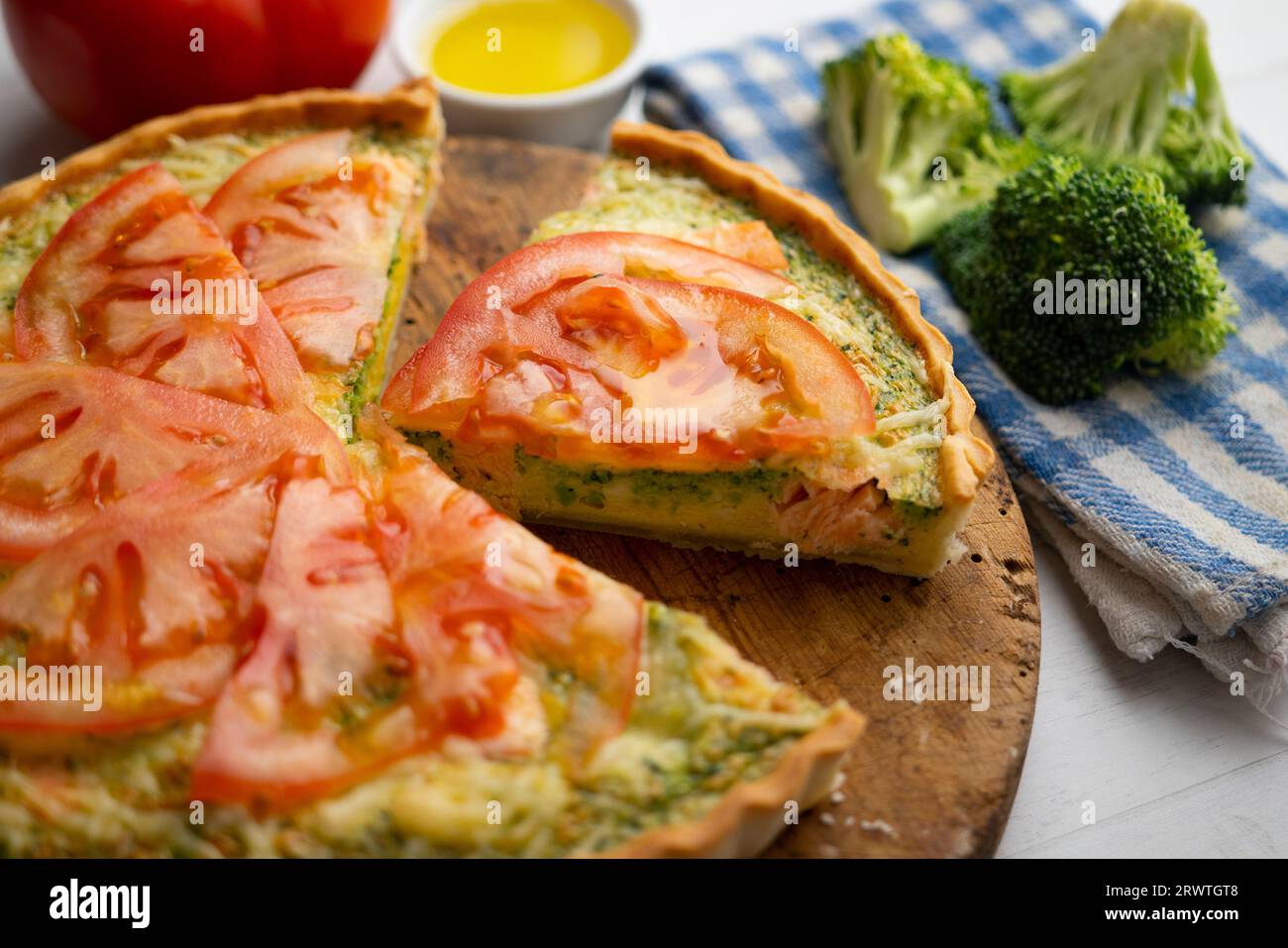 French style quiche with broccoli, salmon, and slices tomato Stock ...
