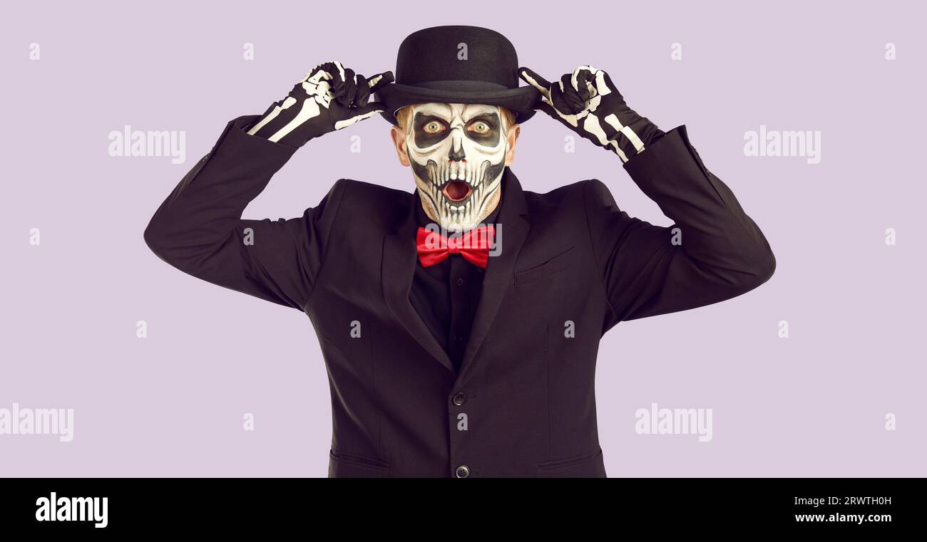 Grimacing Skeleton man in studio Isolated image on lavender background ...