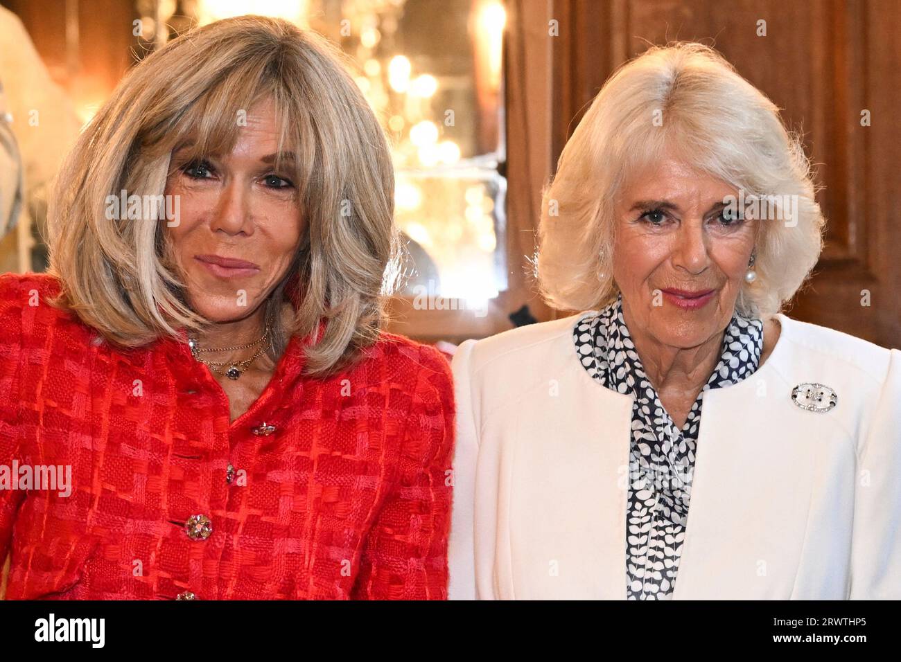French President's wife Brigitte Macron, left, and Britain's Queen ...