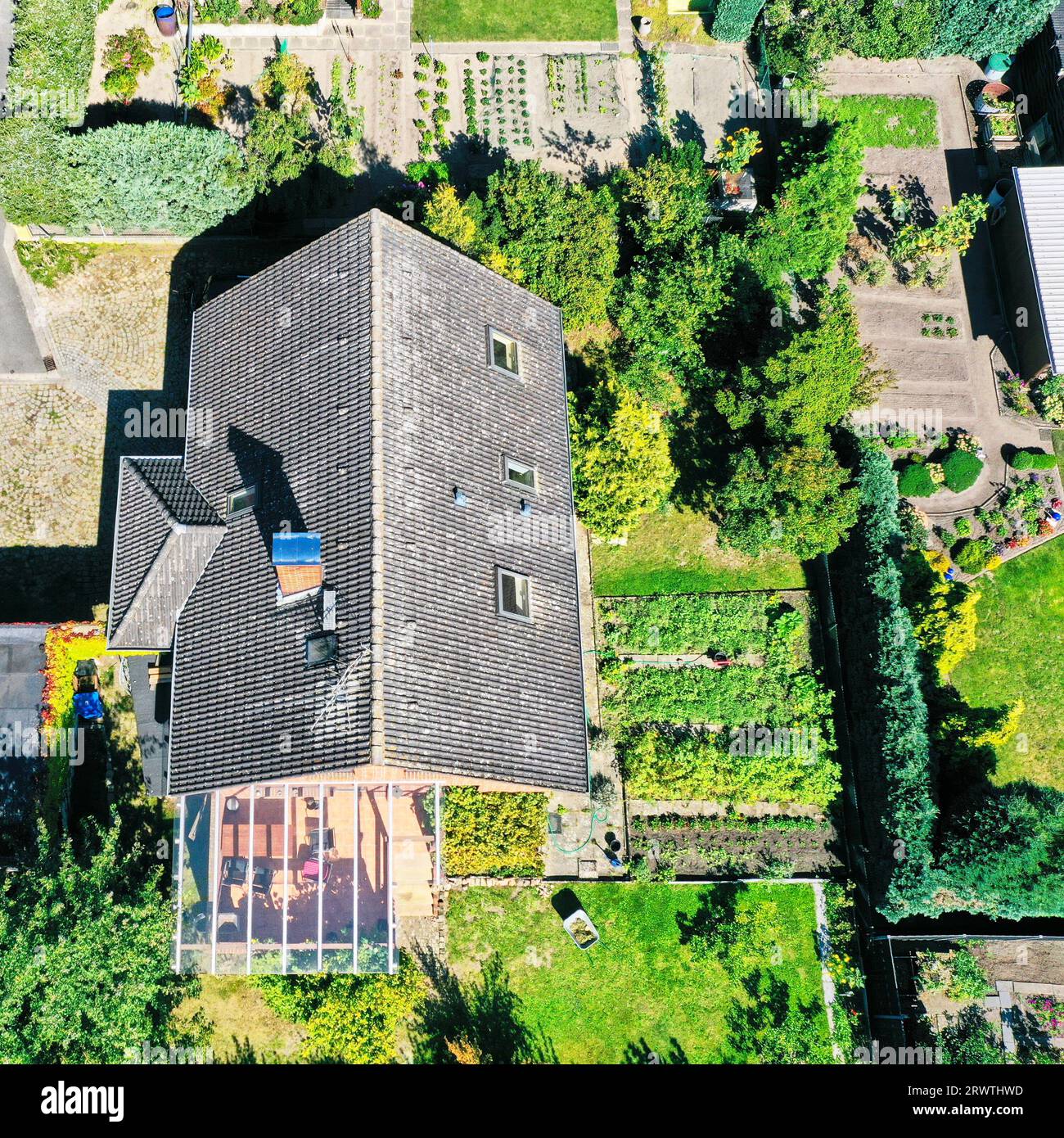 Aerial view of a typical German single-family house on a plot of land ...