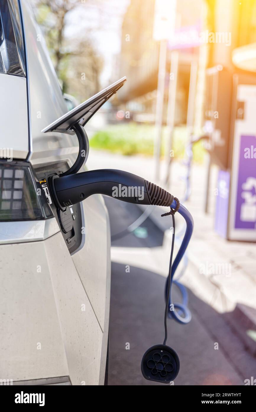 Recharging the battery of an electric car with green energy at charging ...