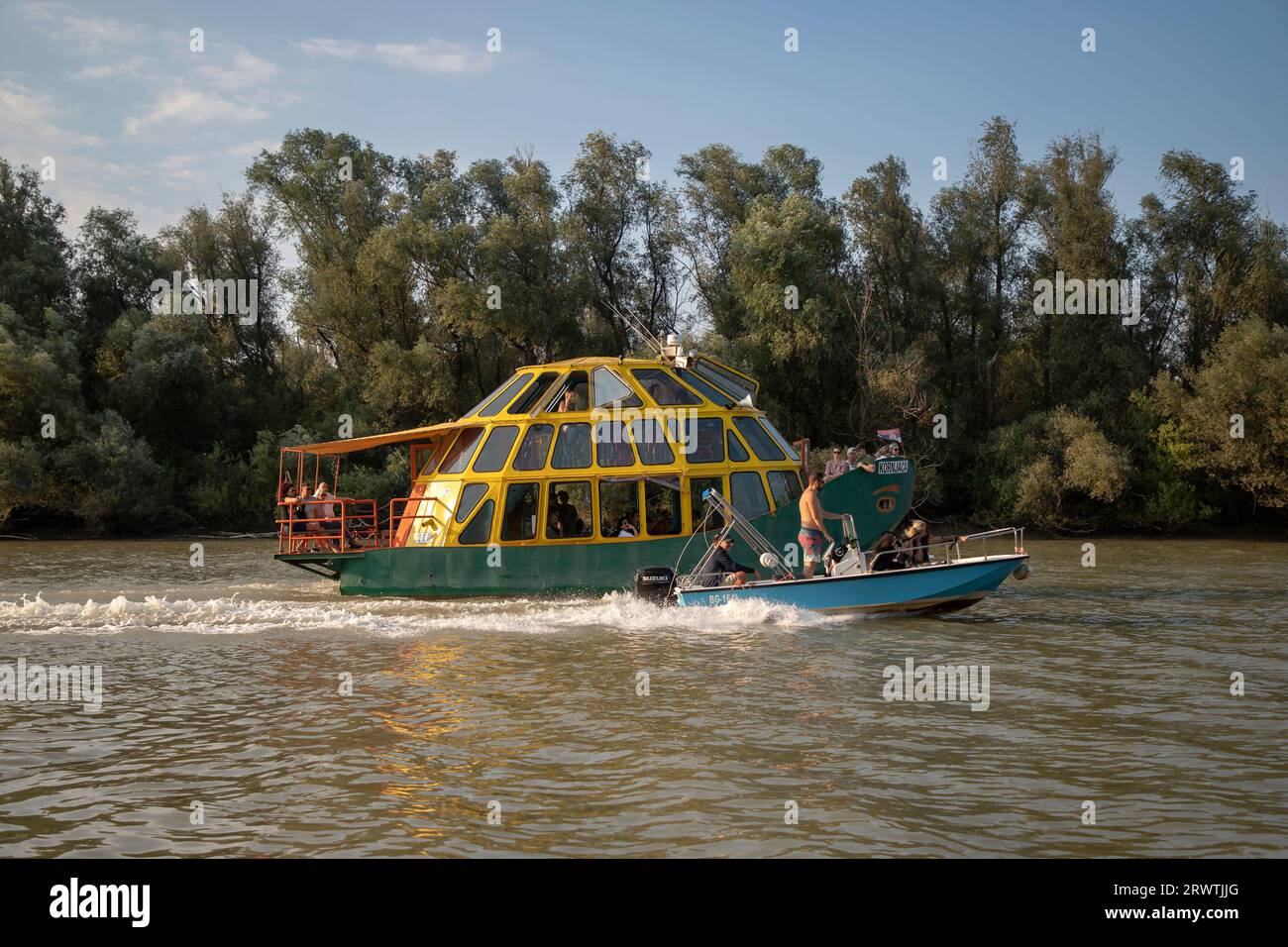 A speedboat overtaking a tourist boat called The Turtle (Kornjača ...