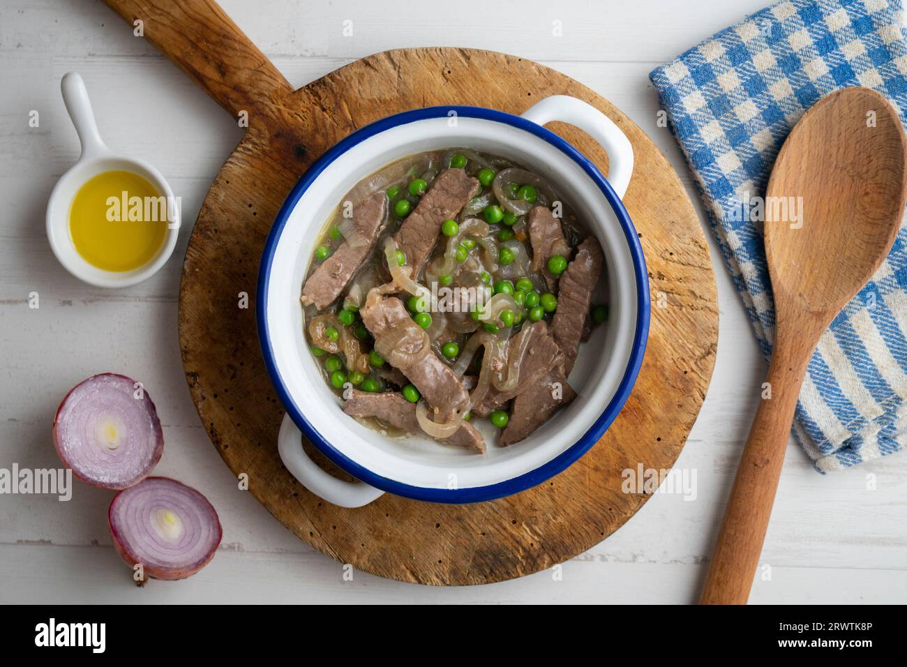 Beef strips cooked with onion and peas Stock Photo - Alamy