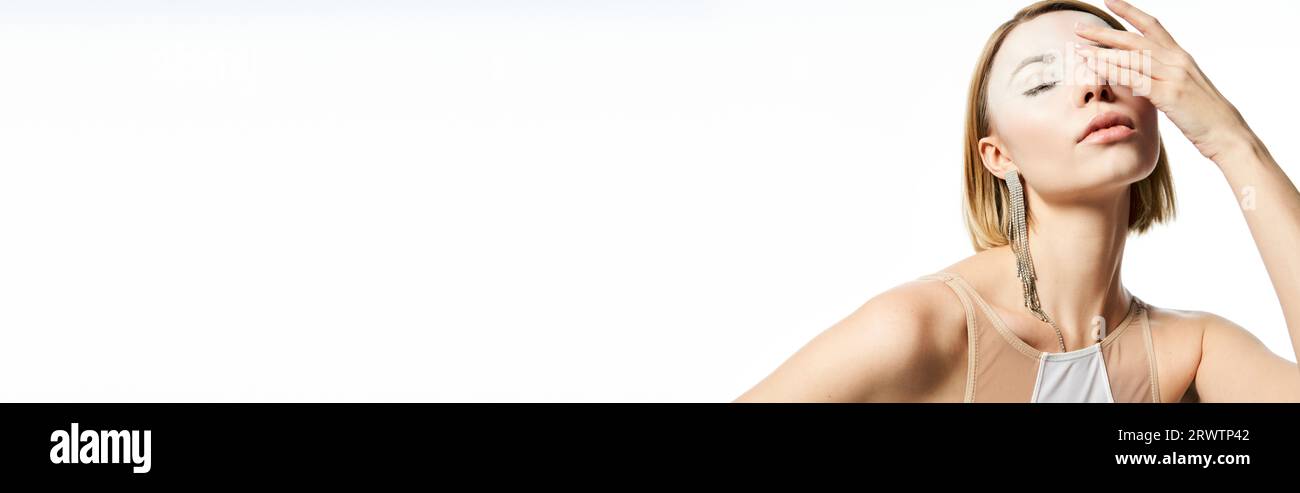 magic charm, woman with angelic face and enchanting makeup obscuring ...