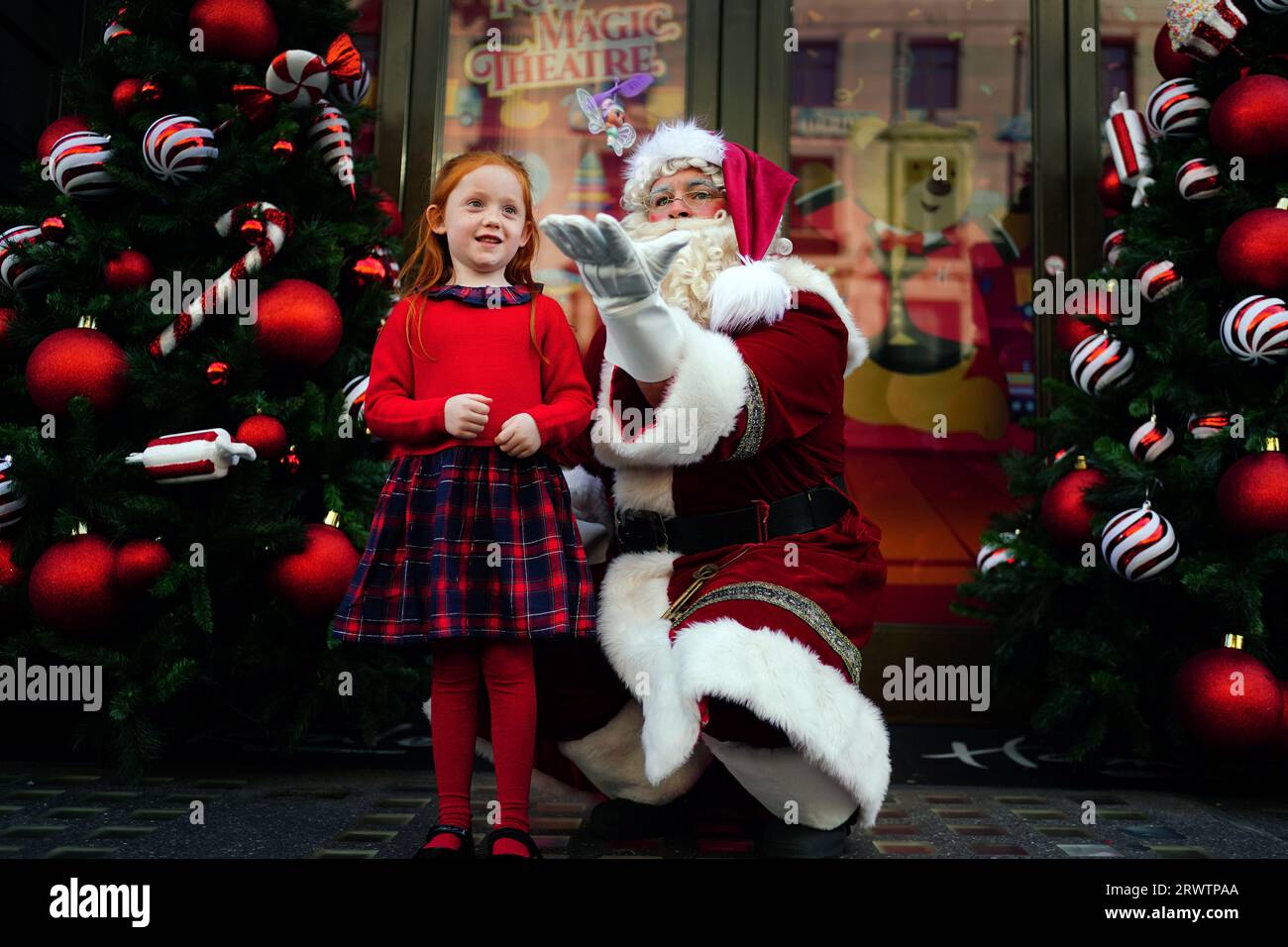 Santa and a young girl play with the LOL Tot character Magic Flyer ...
