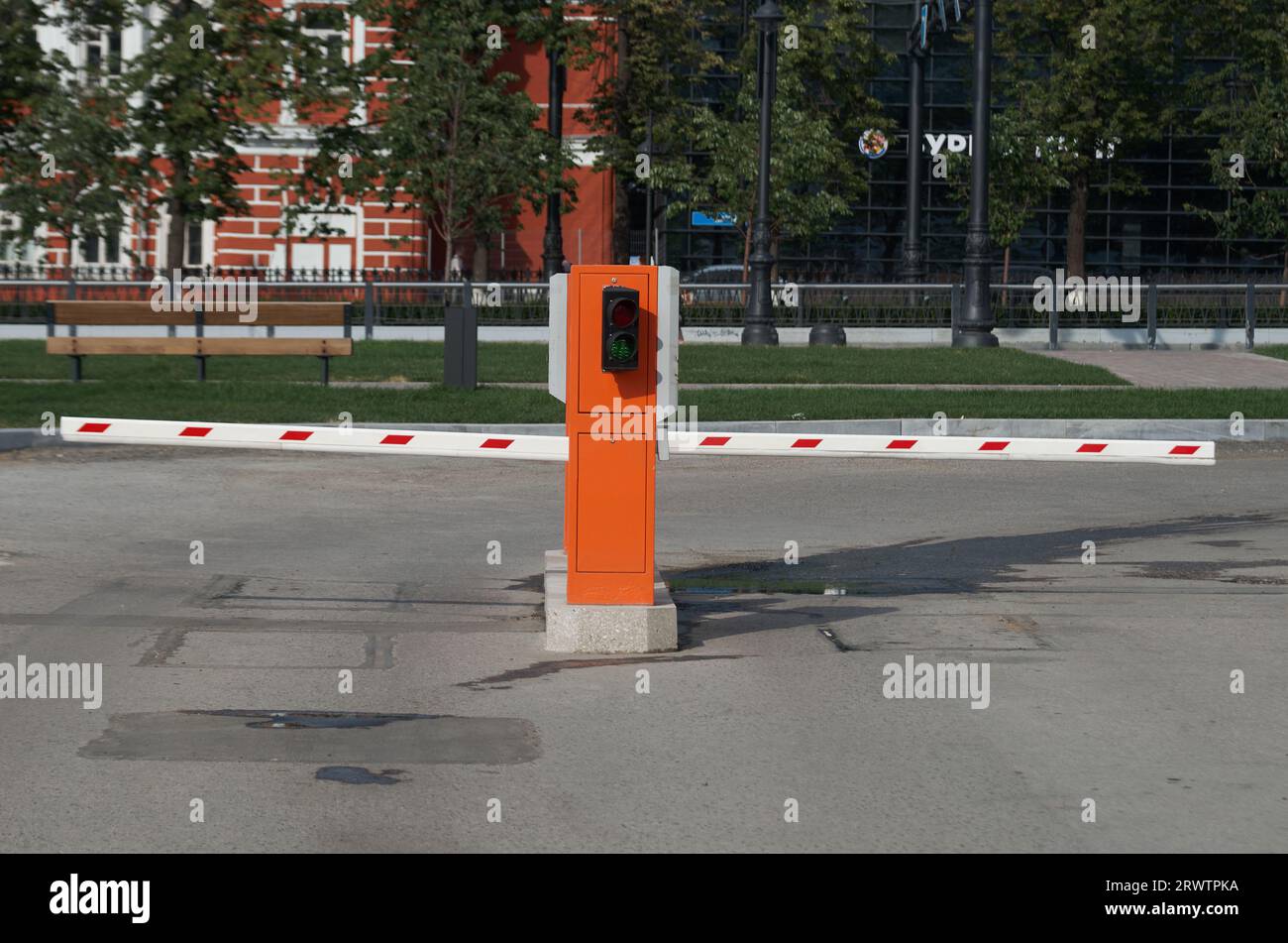 Two barriers for entry and exit from street parking Stock Photo - Alamy