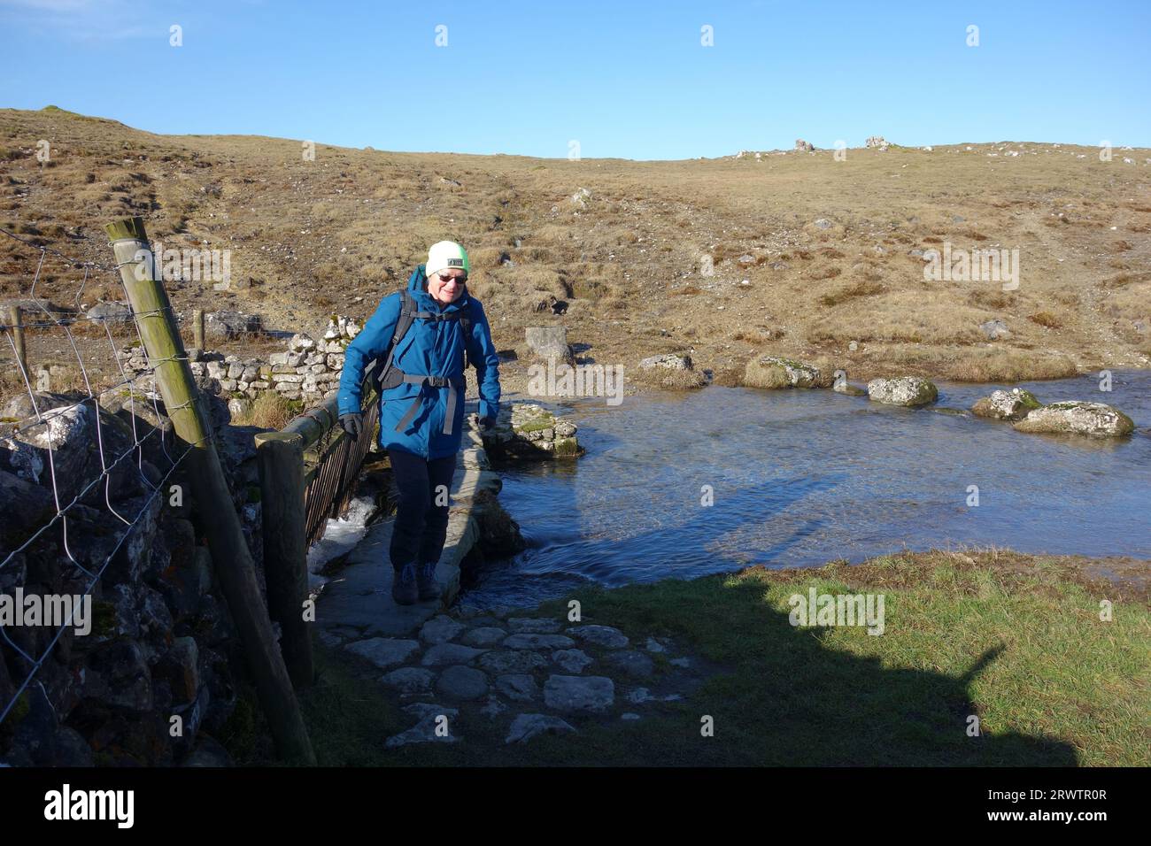 Man Walking (Elderly Hiker) on Stone Bridge over Gordale Beck on ...