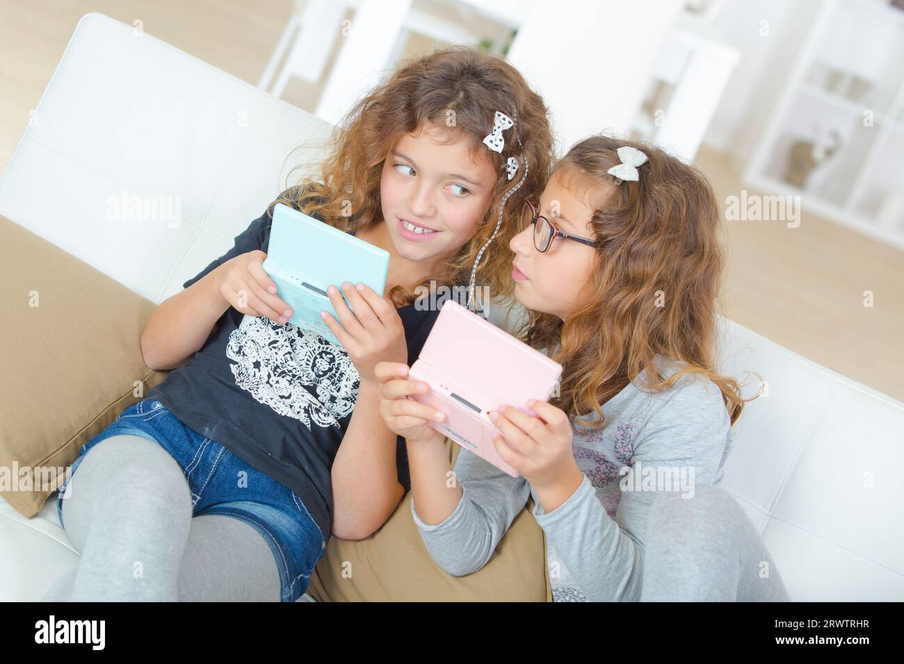 Children with electronic games hi-res stock photography and images - Alamy