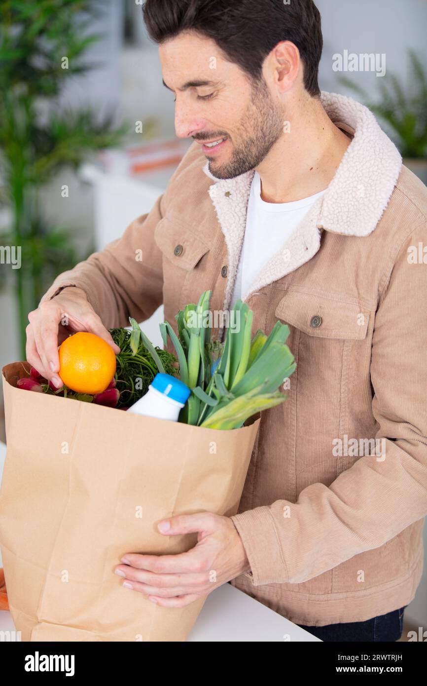 Unpacking groceries from paper hi-res stock photography and images - Alamy