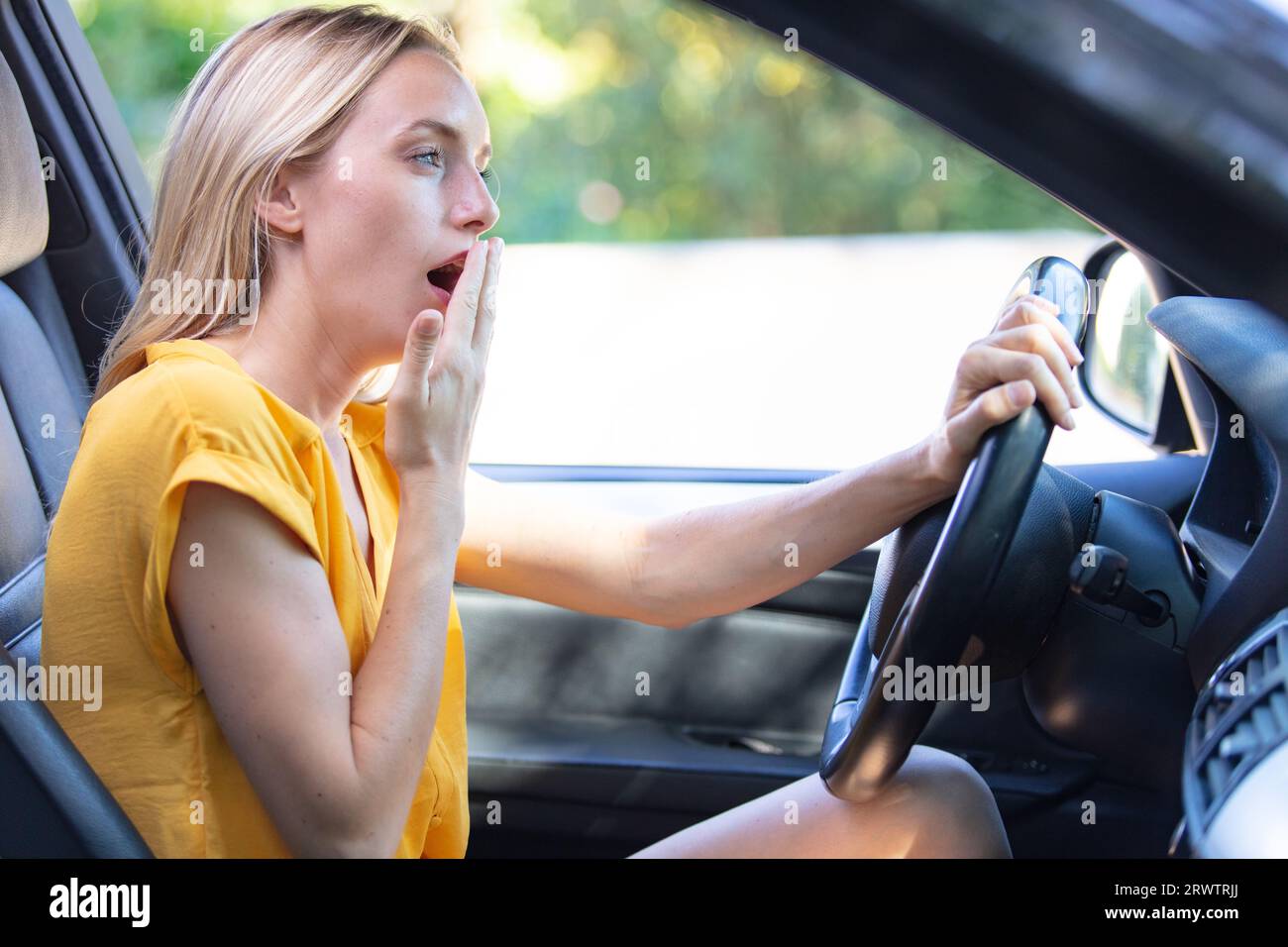 Yawning while driving hi-res stock photography and images - Alamy