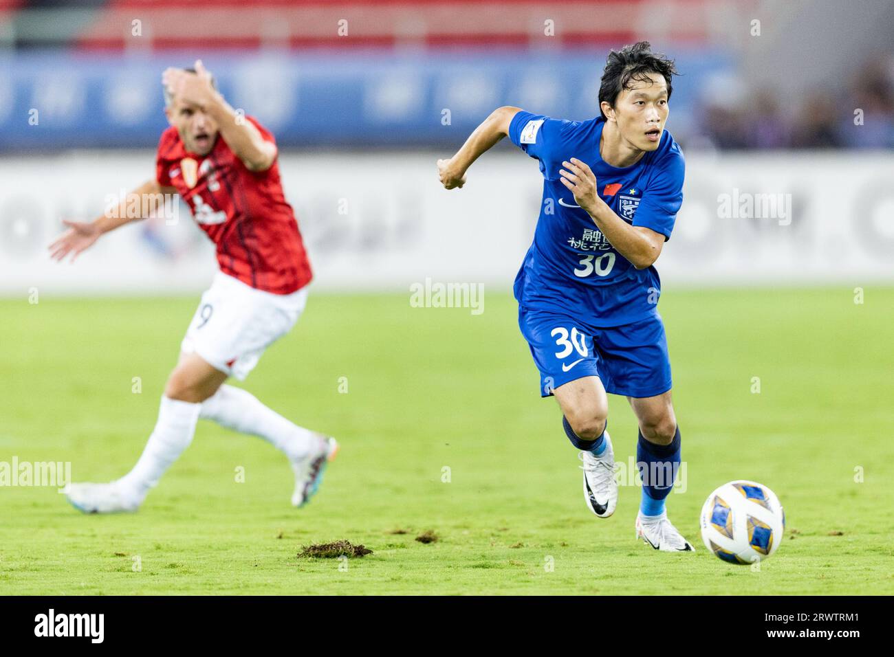 Wuhan, China. 20th Sep, 2023. Xie Pengfei #30 of Wuhan Three Towns advances the ball during the ...