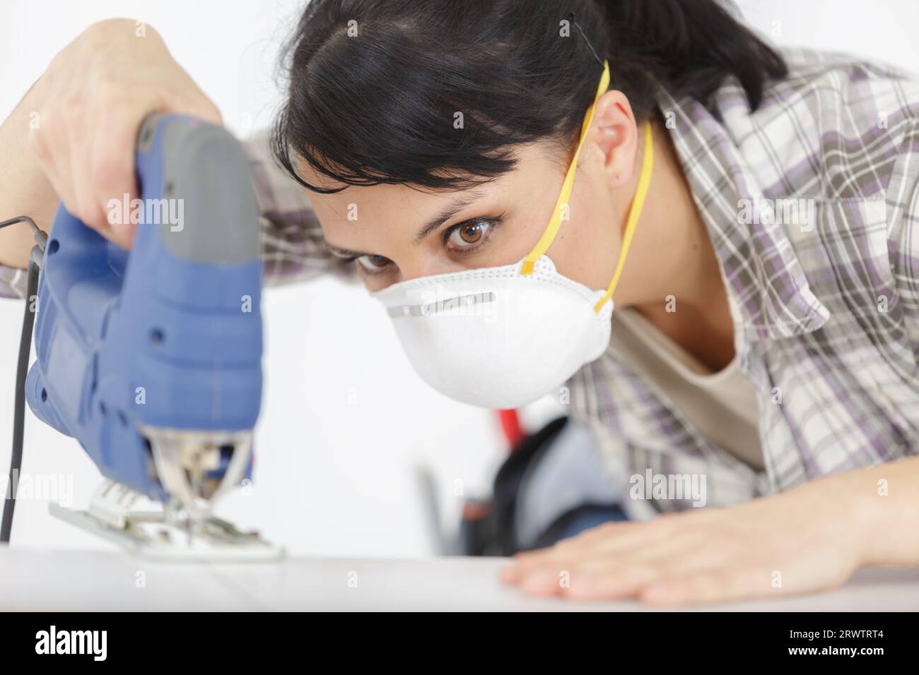 Sawing timber woman hi-res stock photography and images - Alamy