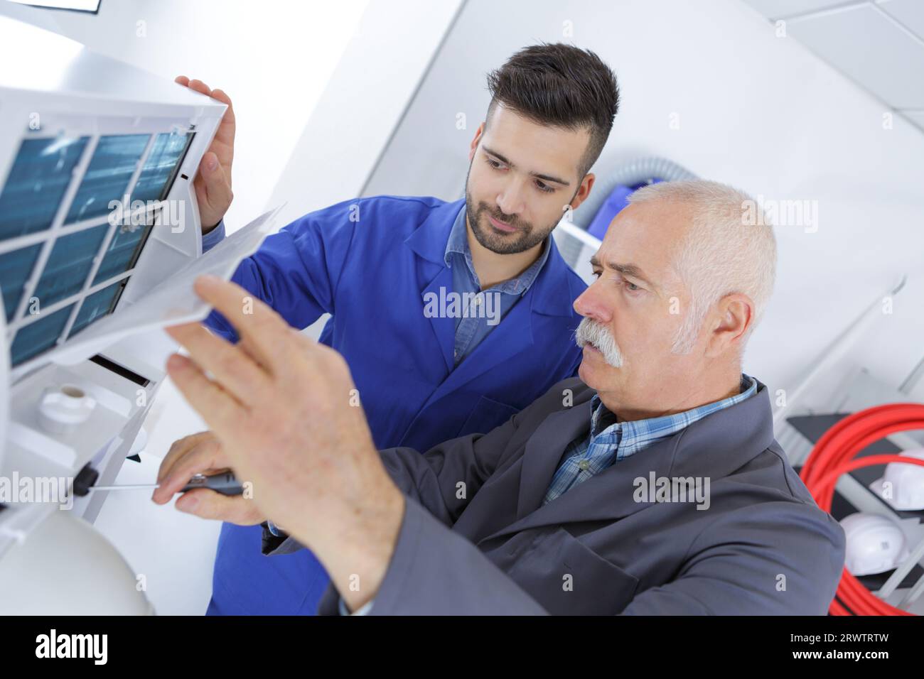 repairing a printer at work by a male technician Stock Photo - Alamy