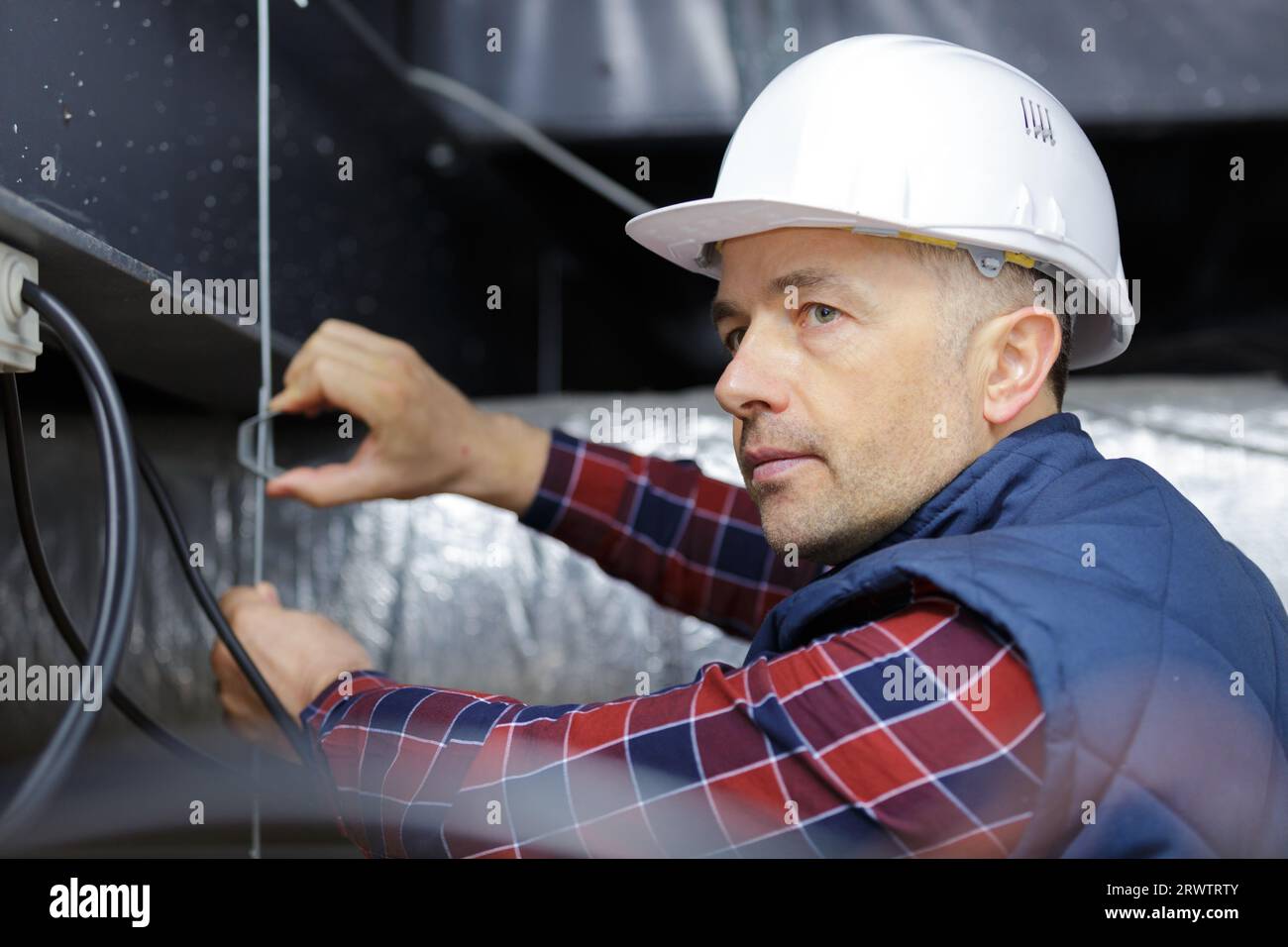 standing on a scaffold to reach the ceiling Stock Photo - Alamy