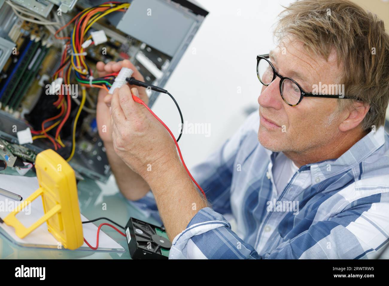 a man sorting tangled wires Stock Photo - Alamy