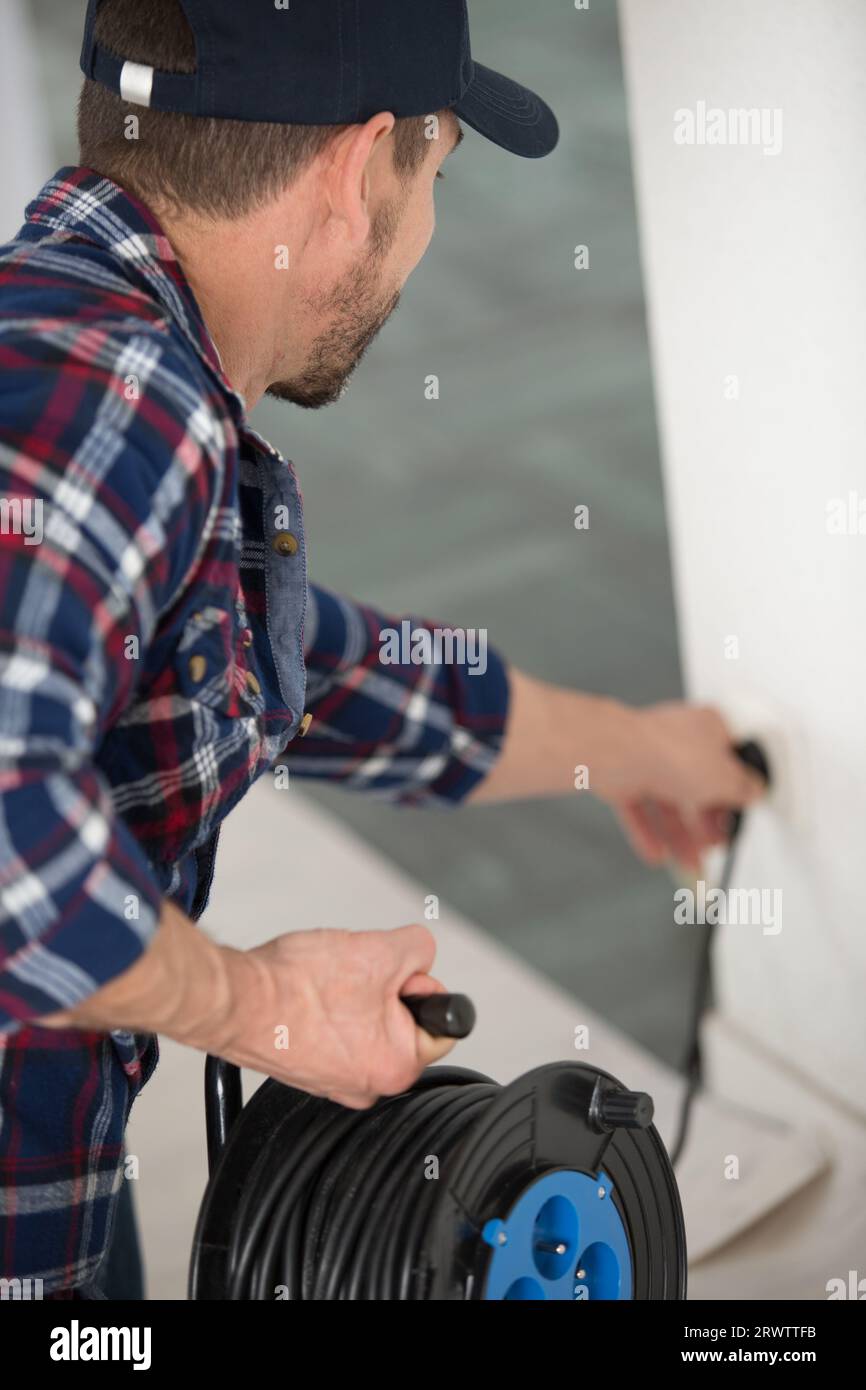Electrician holding mobile device hi-res stock photography and images ...