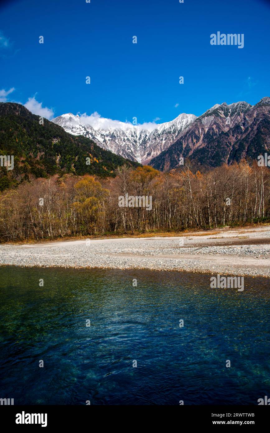 Clear stream Azusa River and Hotaka mountain range in Kamikochi Stock ...