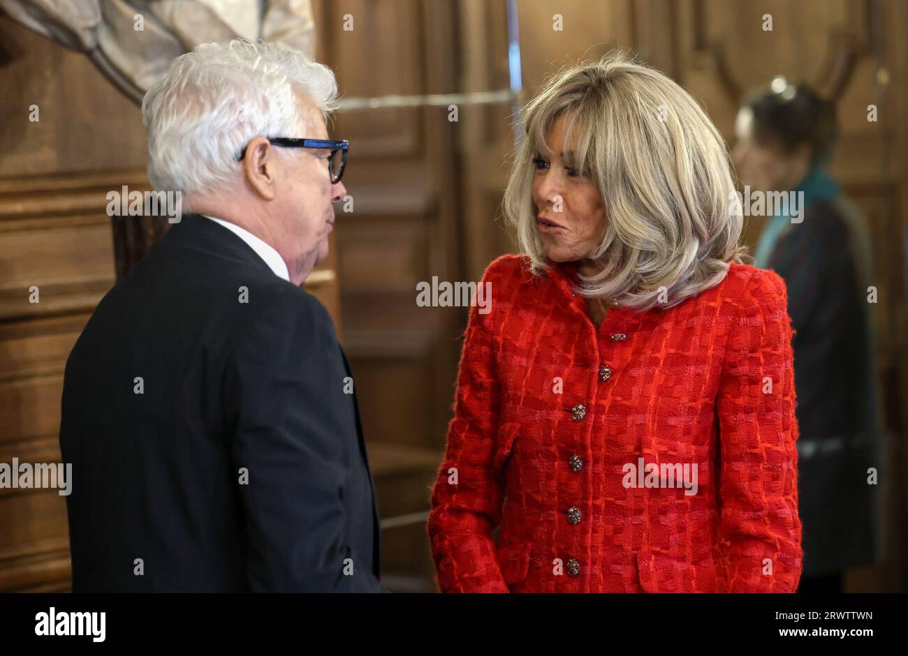 Brigitte Macron speaks to a dignitary during a visit to the ...
