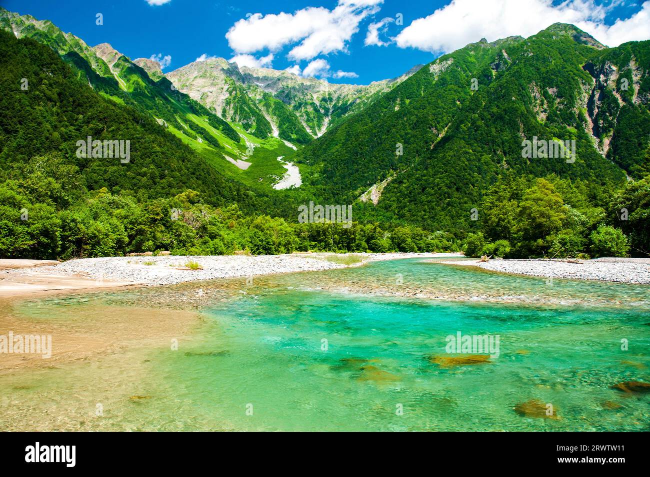 Clear stream Azusa River and Hotaka mountain range in Kamikochi Stock ...