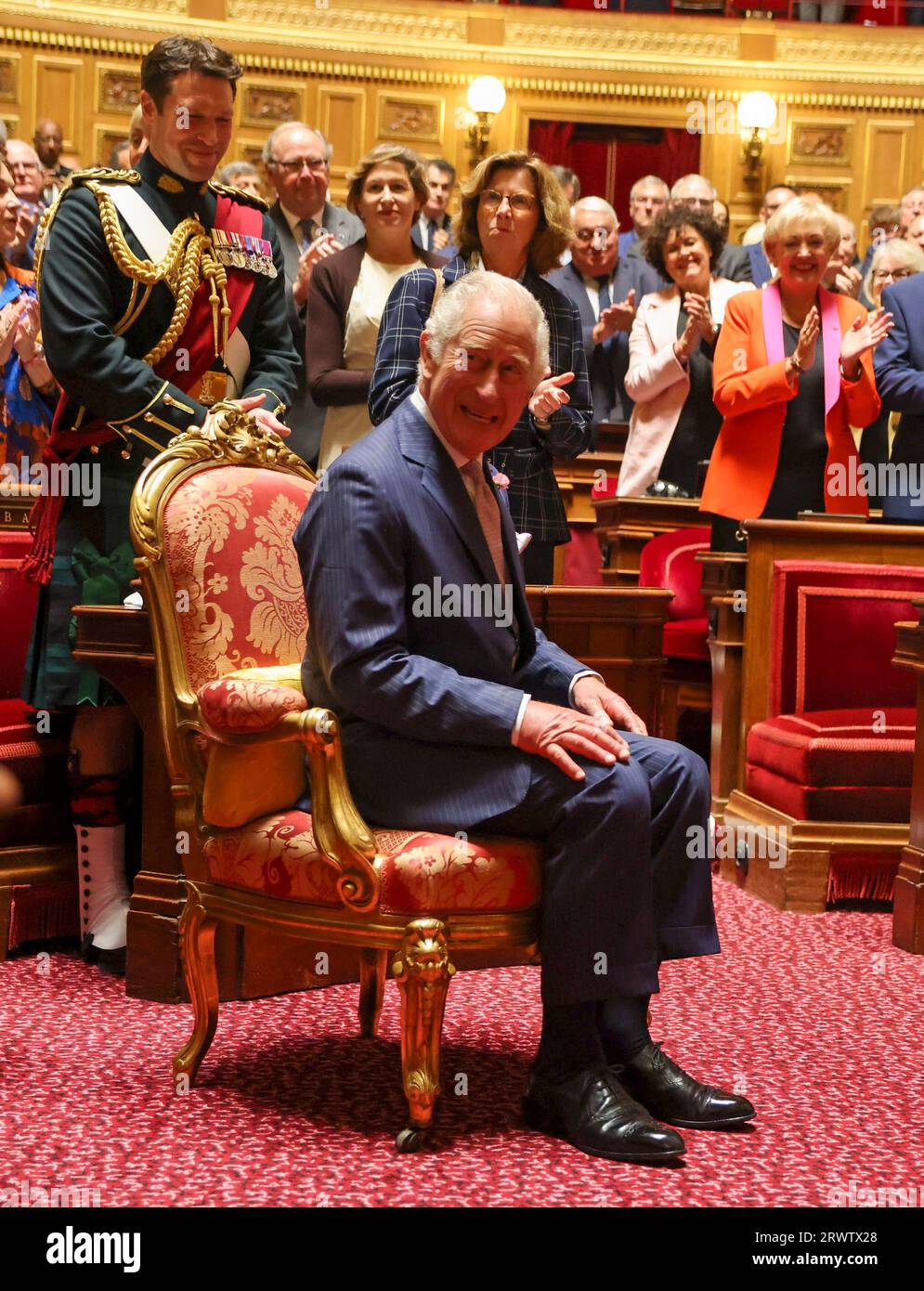 King Charles III takes his seat during a visit to address ...