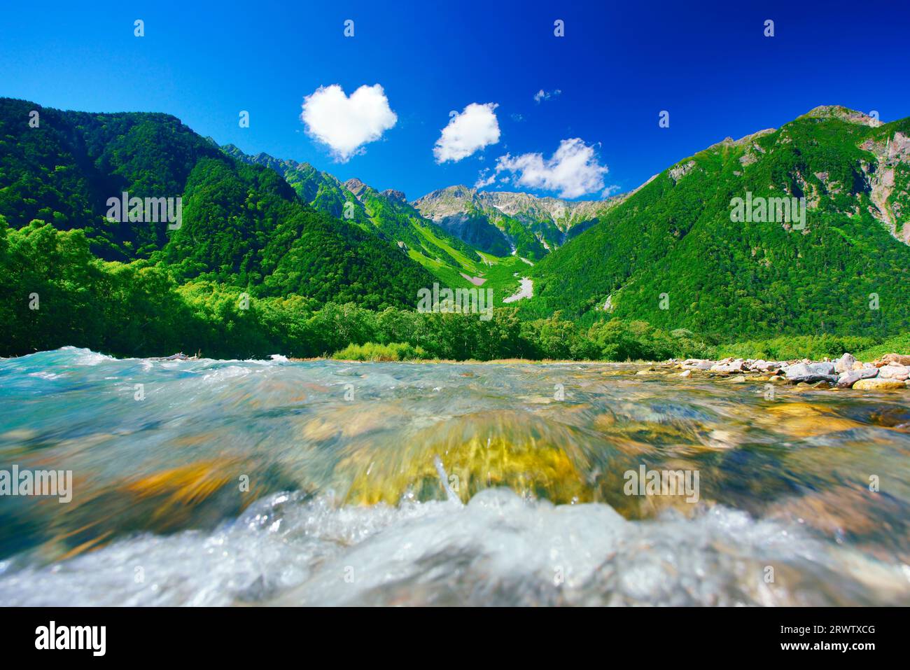 The clear stream of Azusa River, the Hotaka mountain range and heart ...