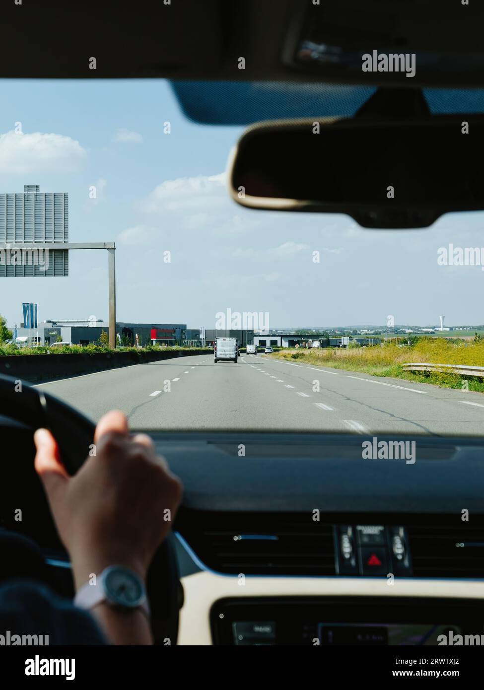 On a French freeway, a female driver exhibits adept control over her ...