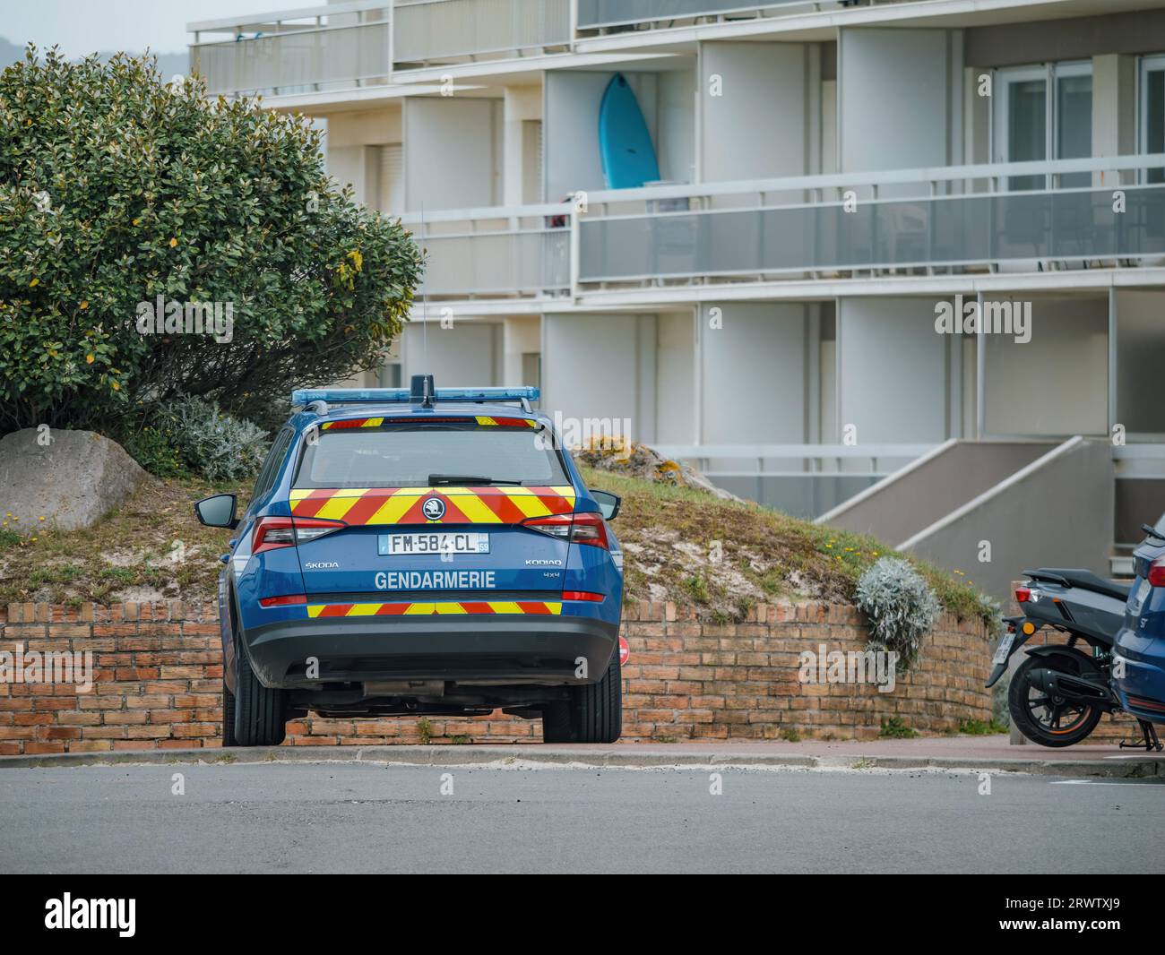 Neufchatel-Hardelot, France - Aug 18, 2023: The rear view of a blue ...