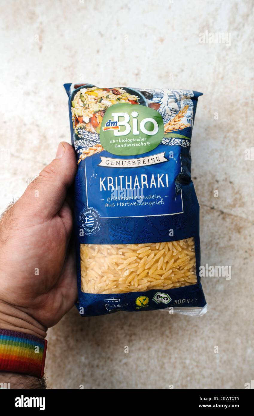 Frankfurt, Germany - Jun 3, 2023: A male hand holding a package of bio ...