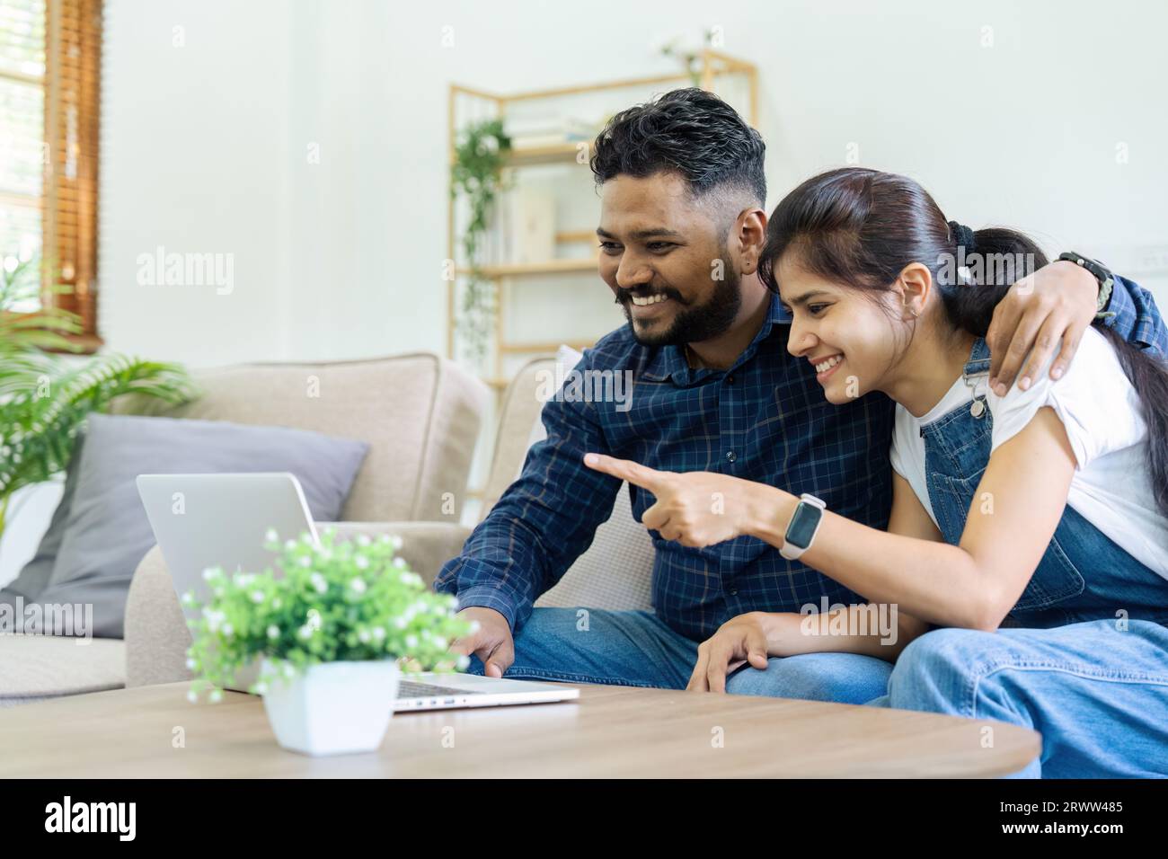 Indian beautiful couple laptop online hi-res stock photography and ...