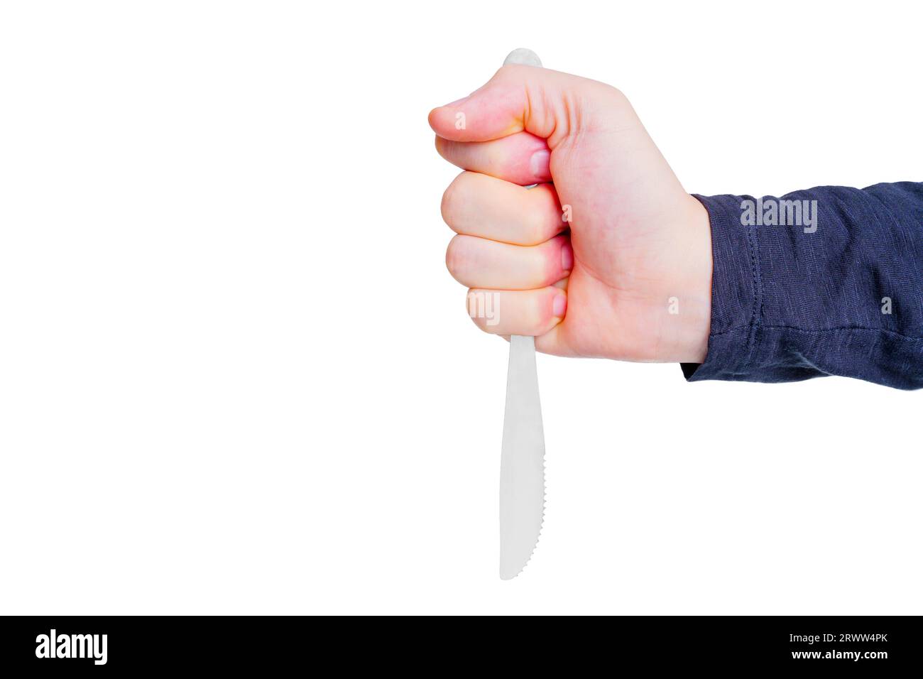 Hand tightly gripping a table knife ready for stabbing isolated on ...