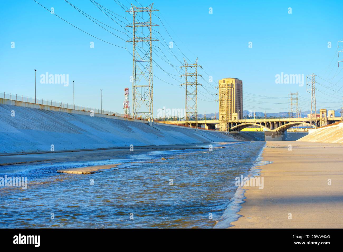 LA River flows relentlessly within its concrete storm channel ...