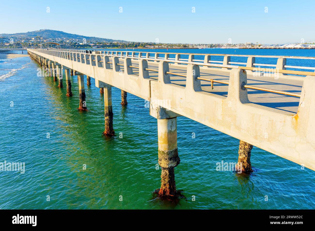 Close-up side view of the concrete structure of the Cabrillo Beach Pier ...