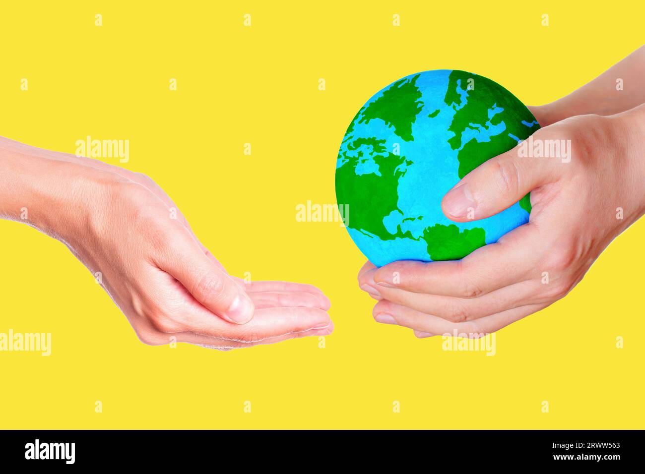 Verdant Earth model is passed from cupped male hands to cupped female ...