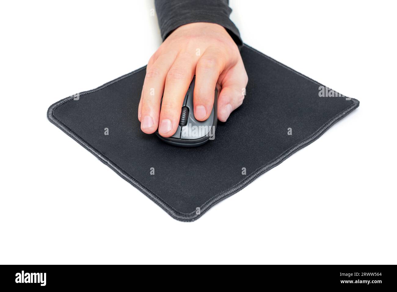 Close-up top view of a male hand using a computer mouse placed on a new ...