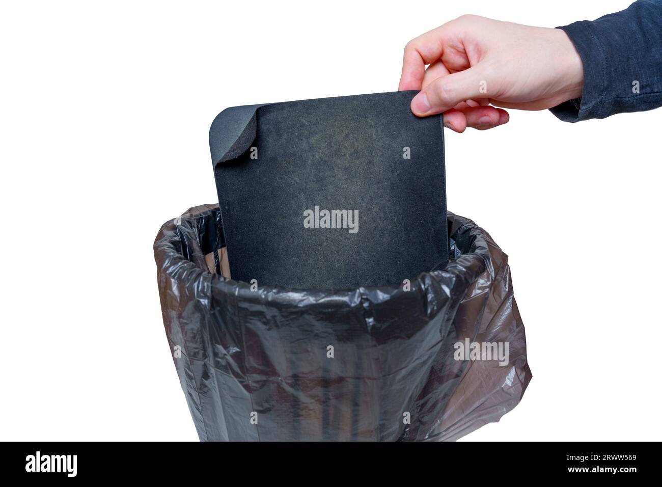Close-up view of a male hand throwing a well-used and dirty computer ...