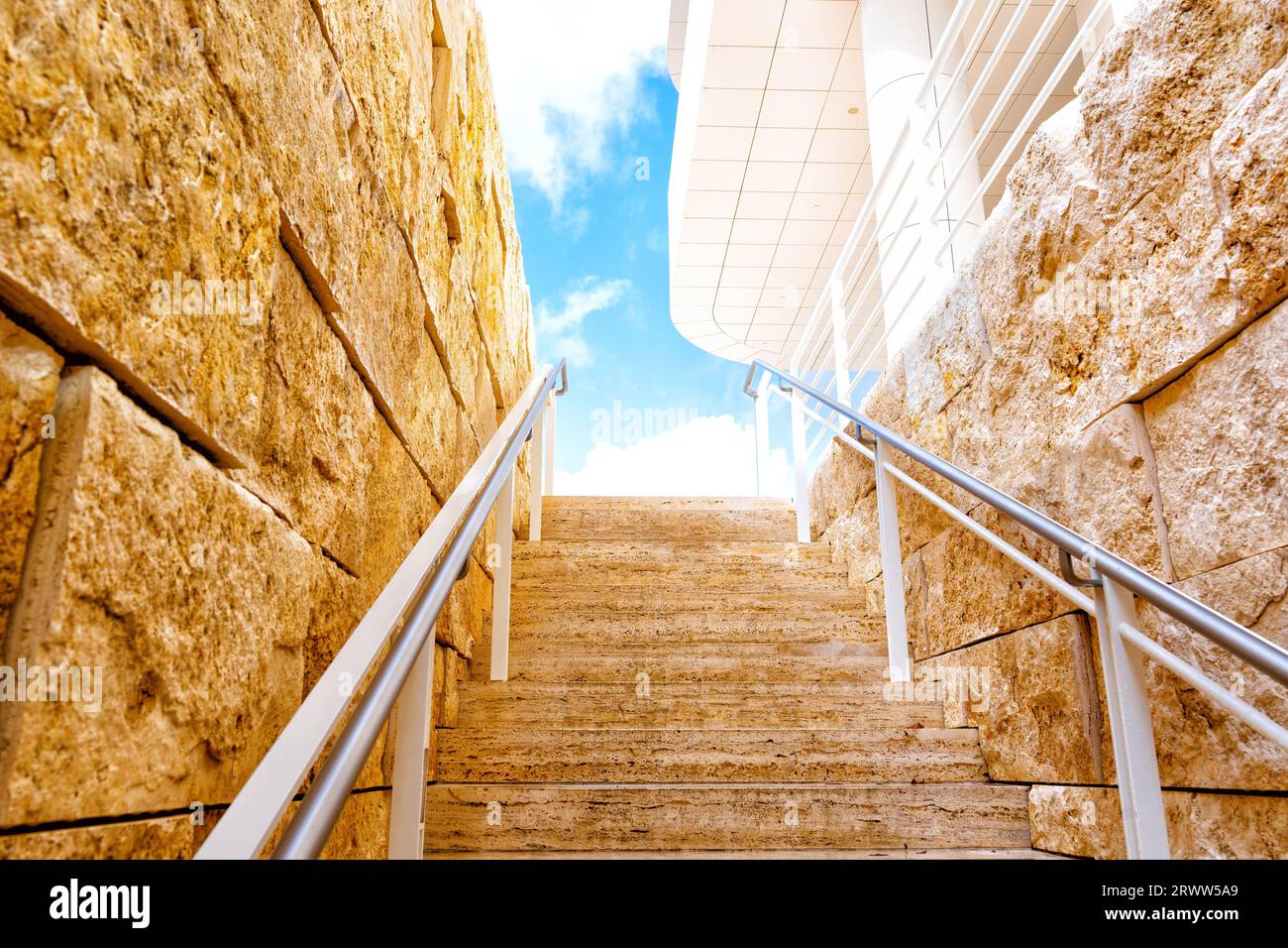 Stone steps between two walls leading to the blue sky Stock Photo - Alamy