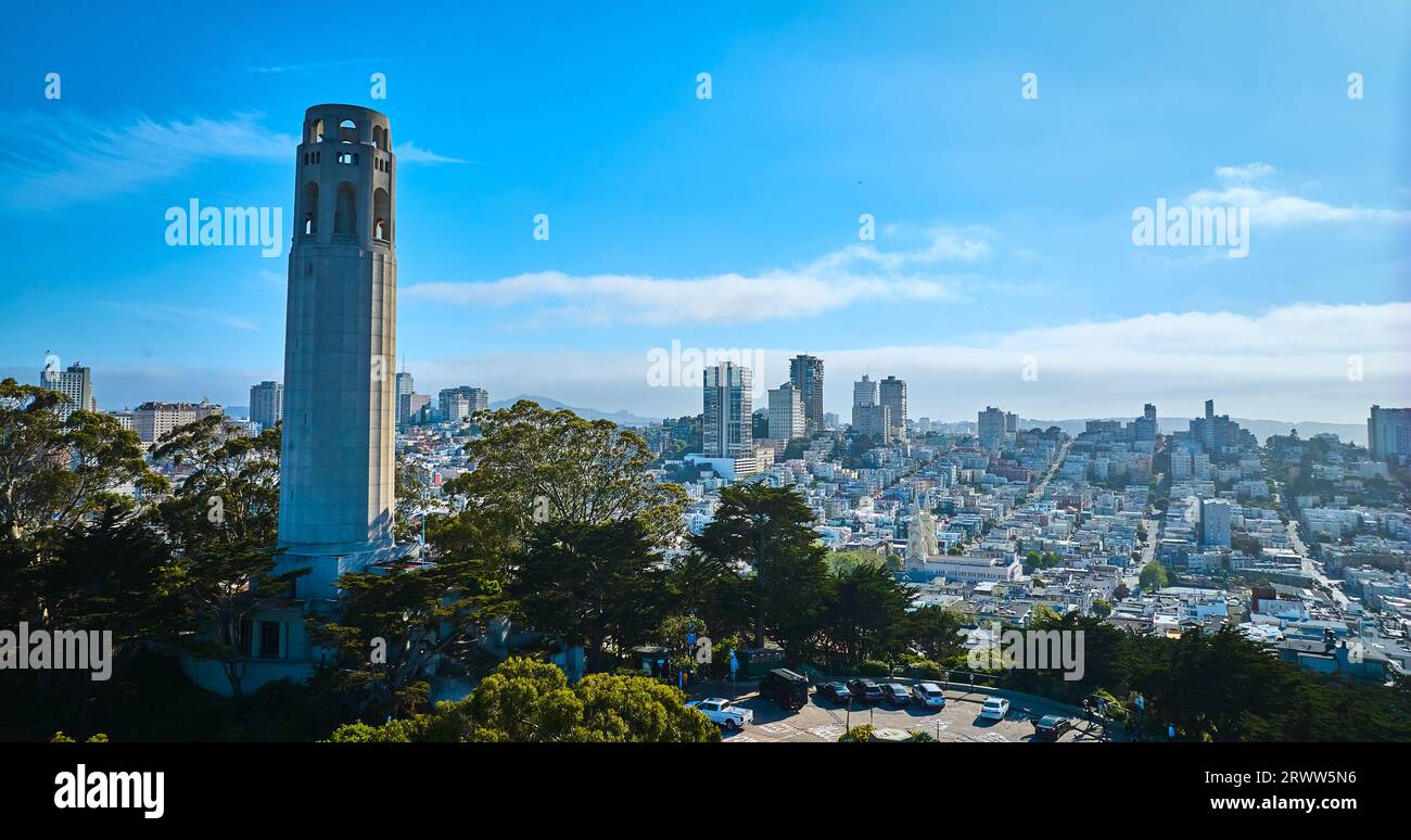 Aerial Coit Tower on Telegraph Hill with view of San Francisco city on ...