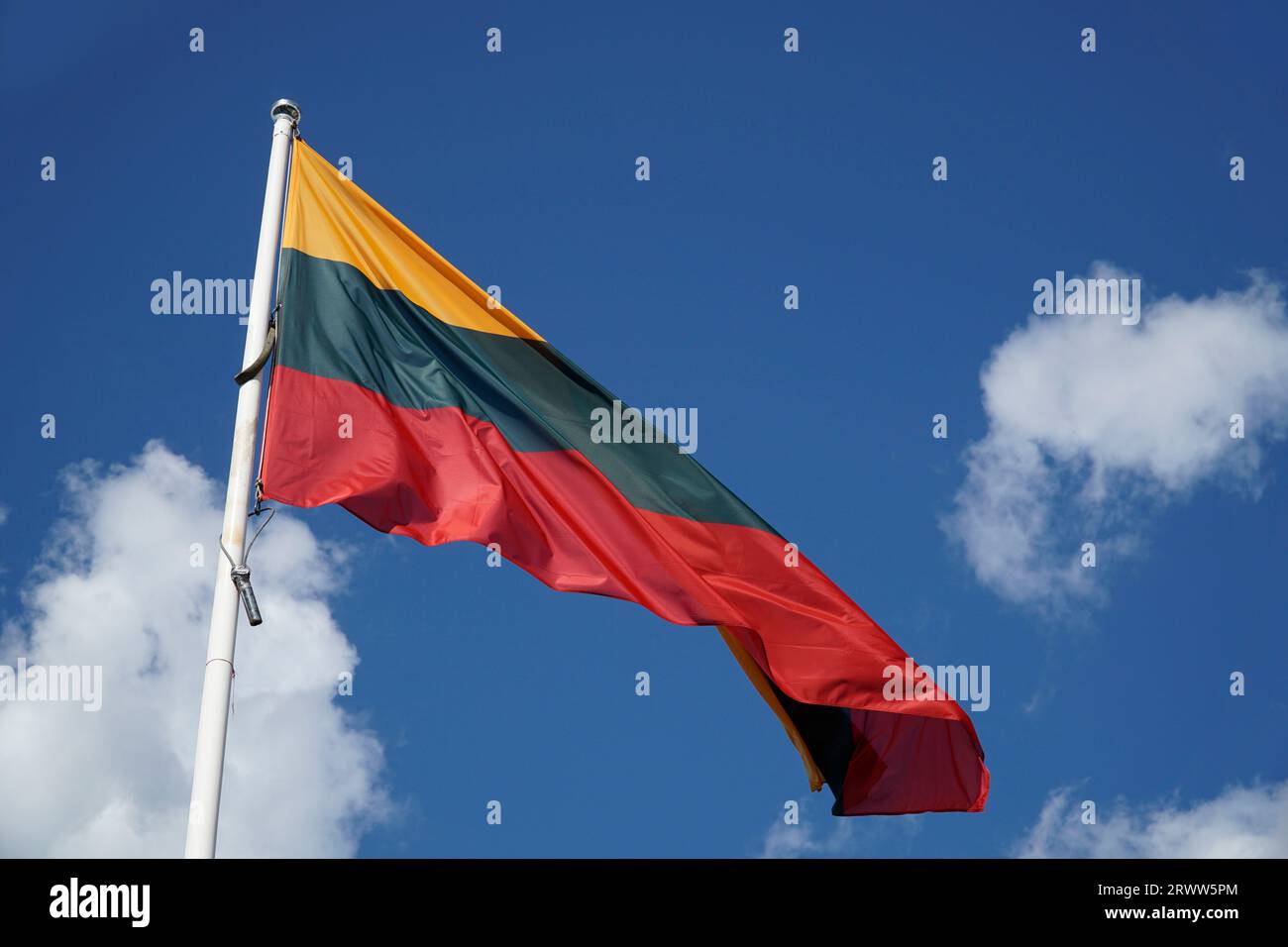 Textile flag of Lithuania and blue sky Stock Photo - Alamy