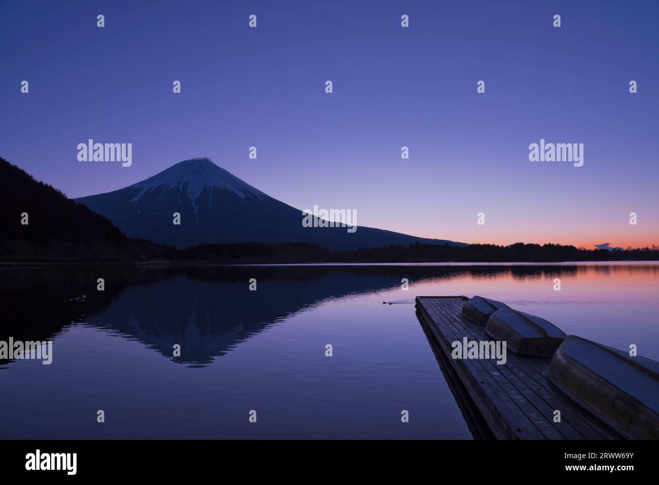 Mt. Fuji in winter at Lake Tanuki with the morning glow and upside down ...
