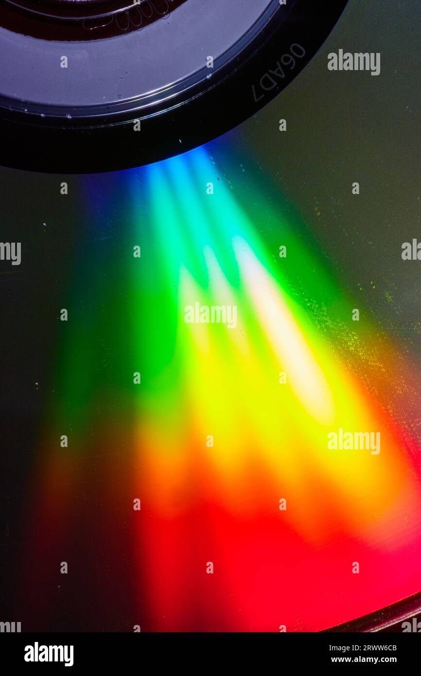 Colorful burst of rainbow stream of light form abstract CD center ...