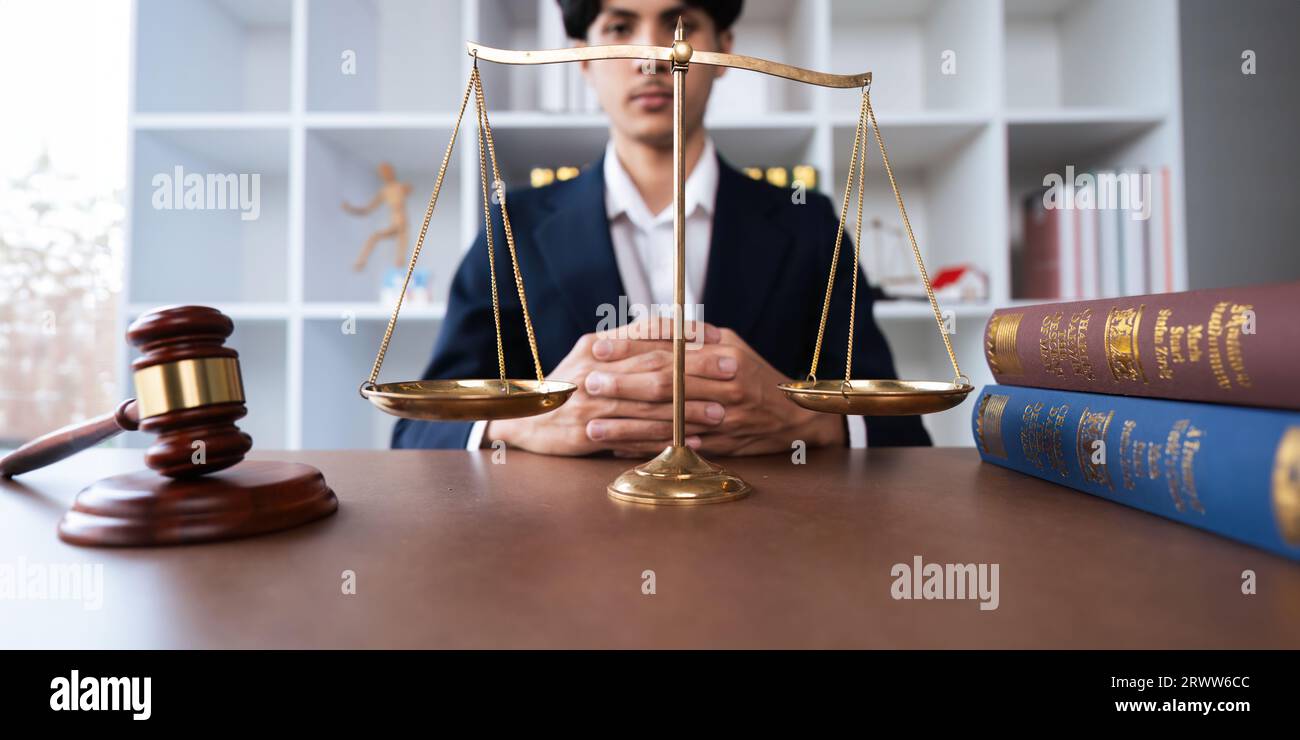 Portrait of a judge hold judges gavel and old scales concept of justice ...