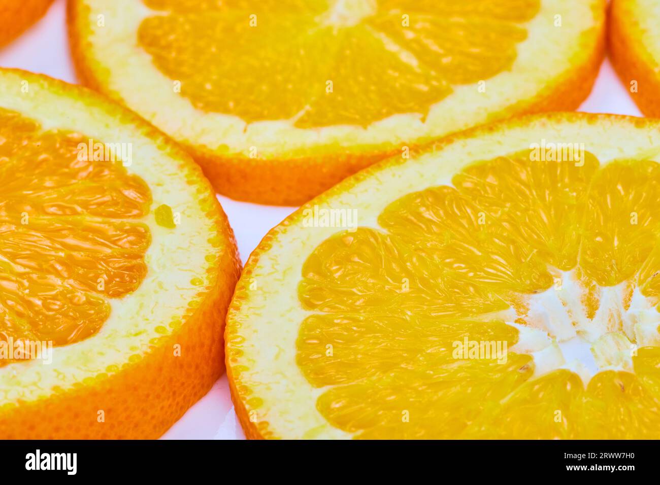 Bright close up three of orange slices with fleshy center and white ...