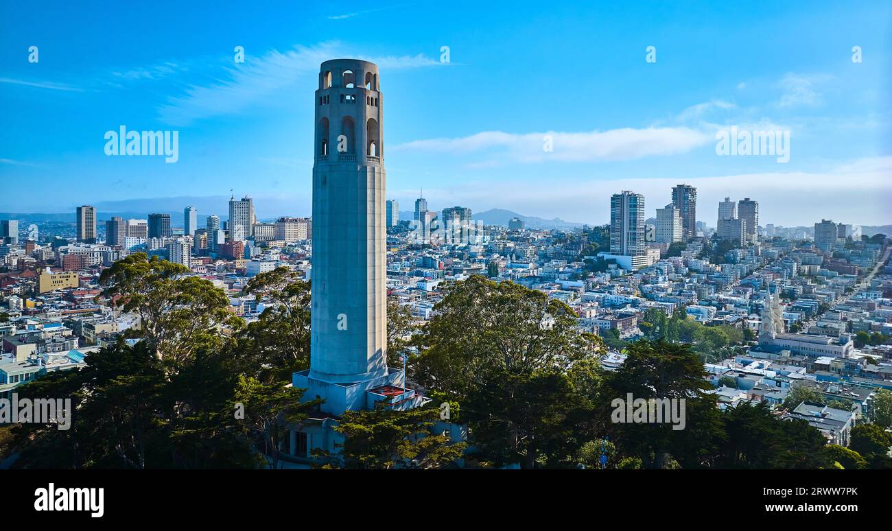 Aerial Coit Tower on Telegraph Hill with view of San Francisco city on ...