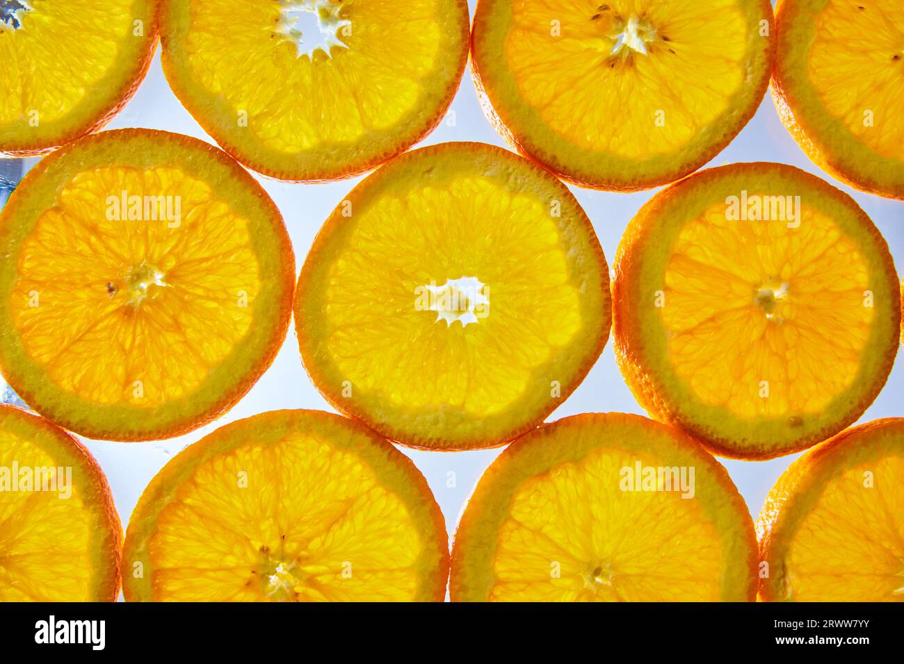 Close up wall of see through orange slices on white background Stock ...