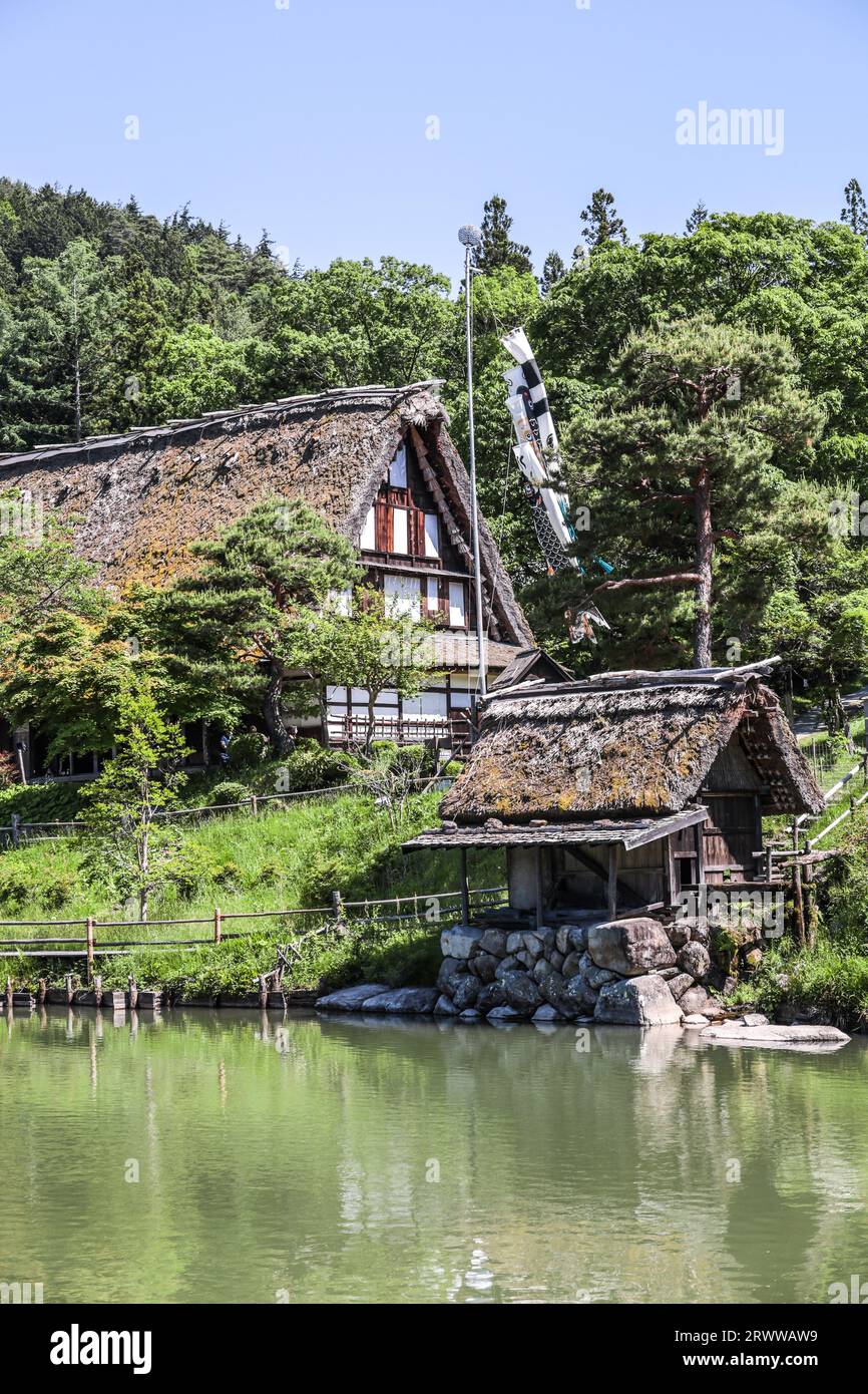 Former Nishioka House and Battari Hut with carp streamers going up in ...