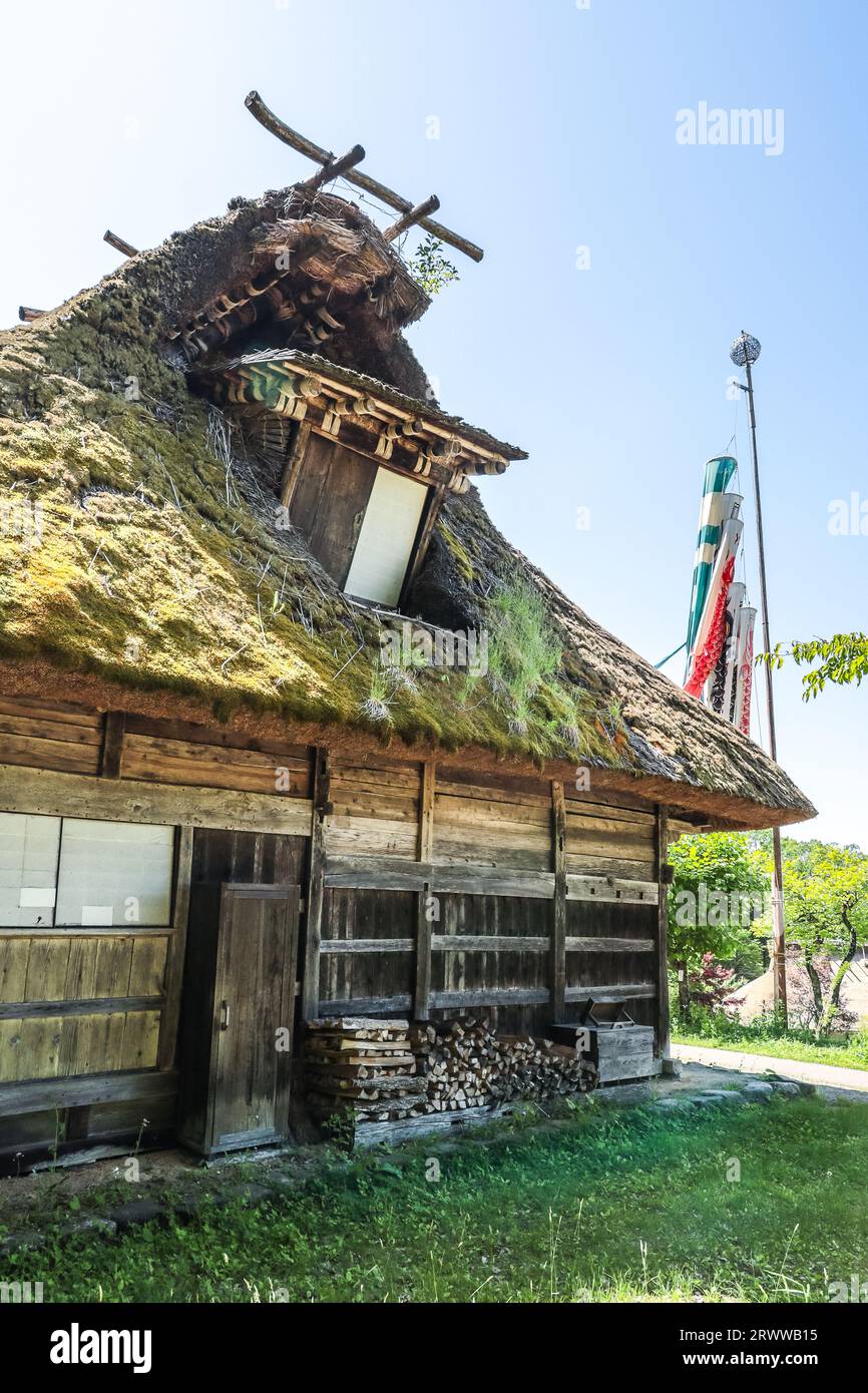 Former August 1st House with carp streamers in the village of Hida ...